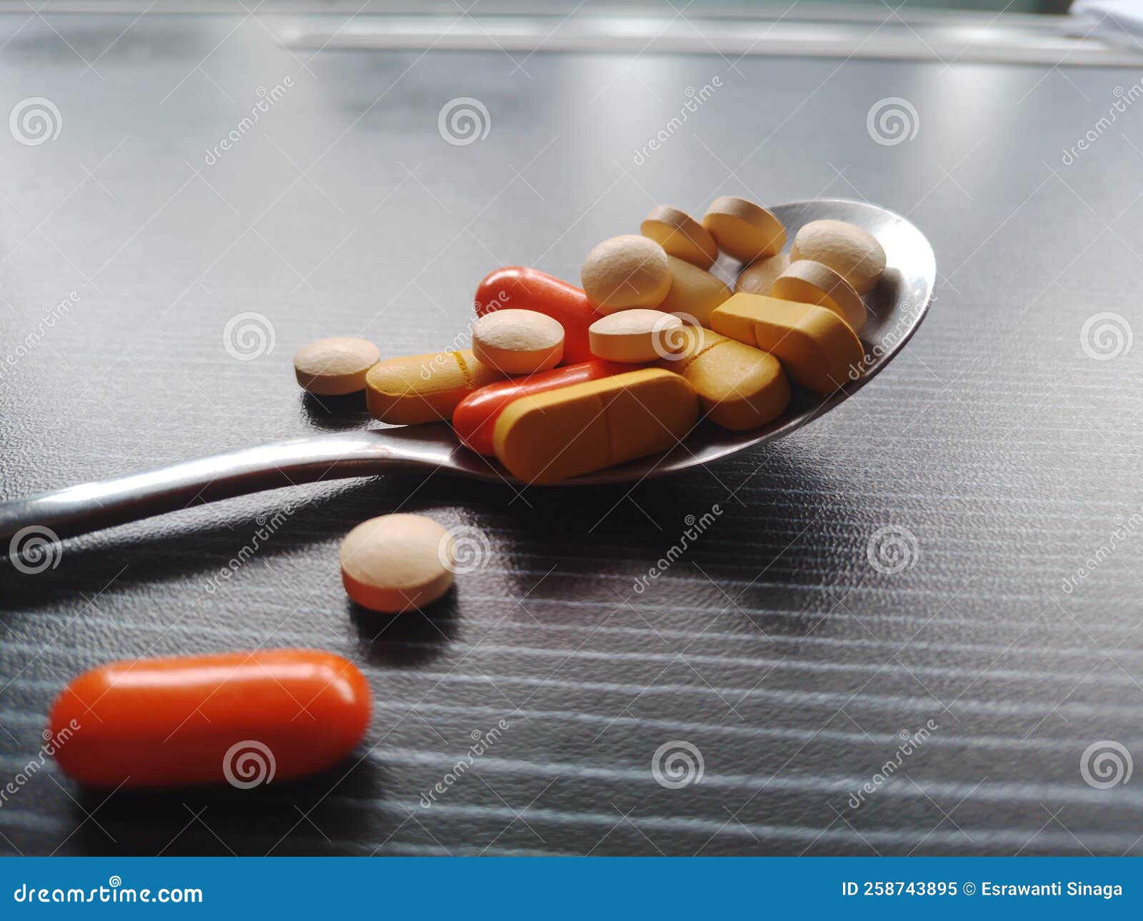 A Spoon full of pills stock image. Image of pills, medicine - 258743895