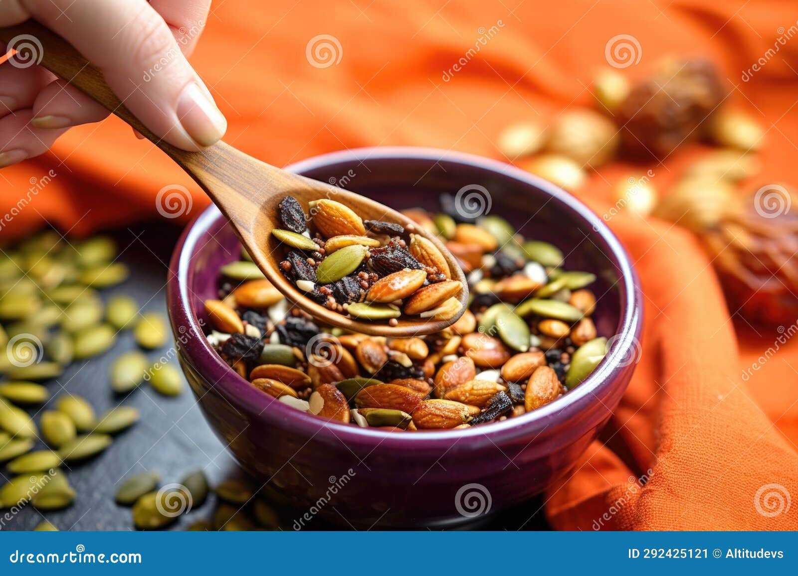 Spoon in Hand, Poised Over an Acai Bowl with Pumpkin Seeds Stock Image ...