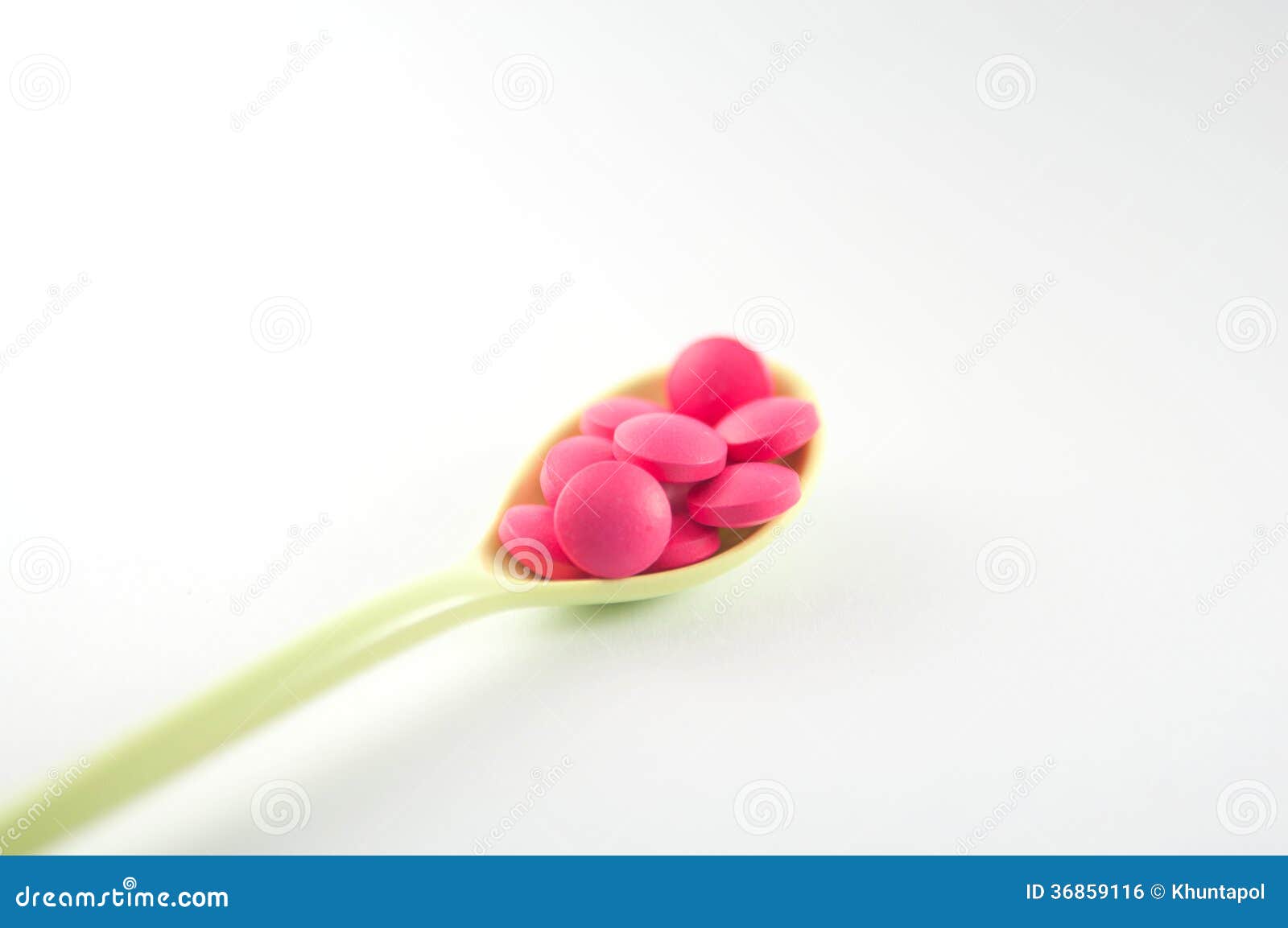 Spoon with medicine tablet stock photo. Image of group - 36859116