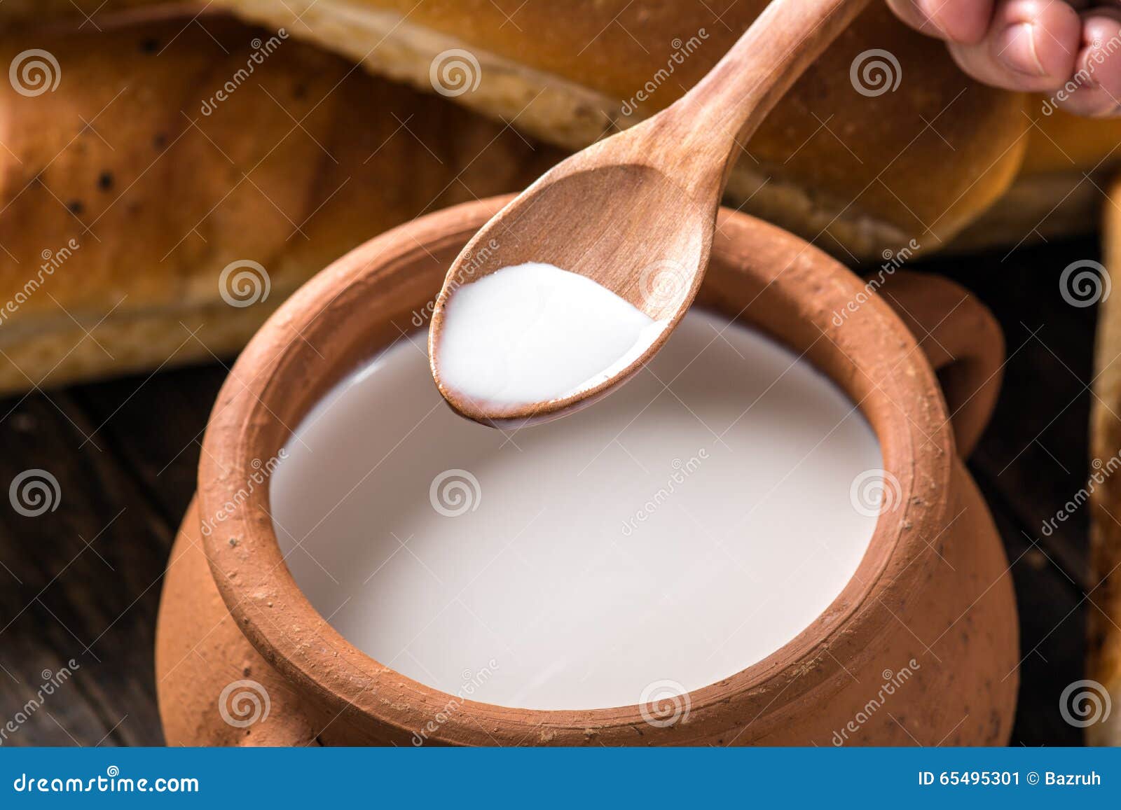 Spoon with milk in hand stock image. Image of backgrounds - 65495301