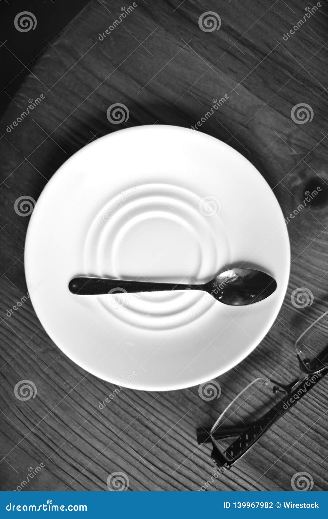 Spoon on a plate stock photo. Image of dish, banquet - 139967982