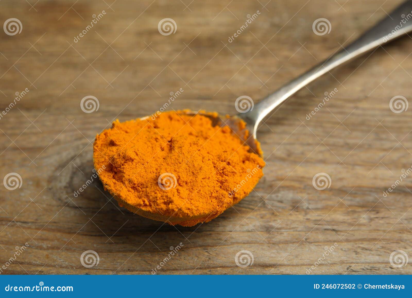 Spoon with Saffron Powder on Wooden Table, Closeup Stock Photo - Image ...
