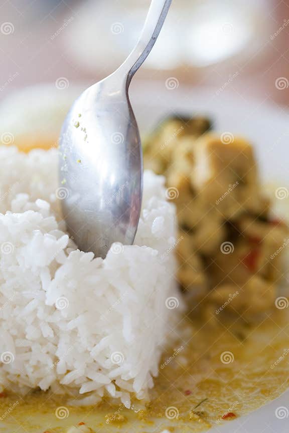Spoon a scoop of rice stock photo. Image of spoon, dinner - 57995666