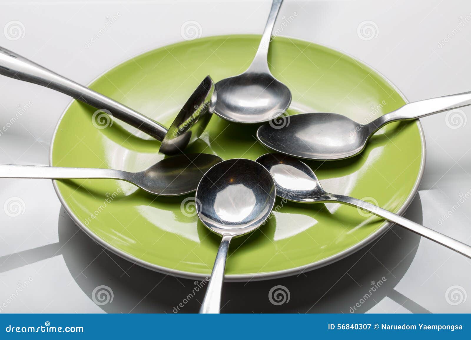 Spoon set on plate stock image. Image of banquet, plate - 56840307