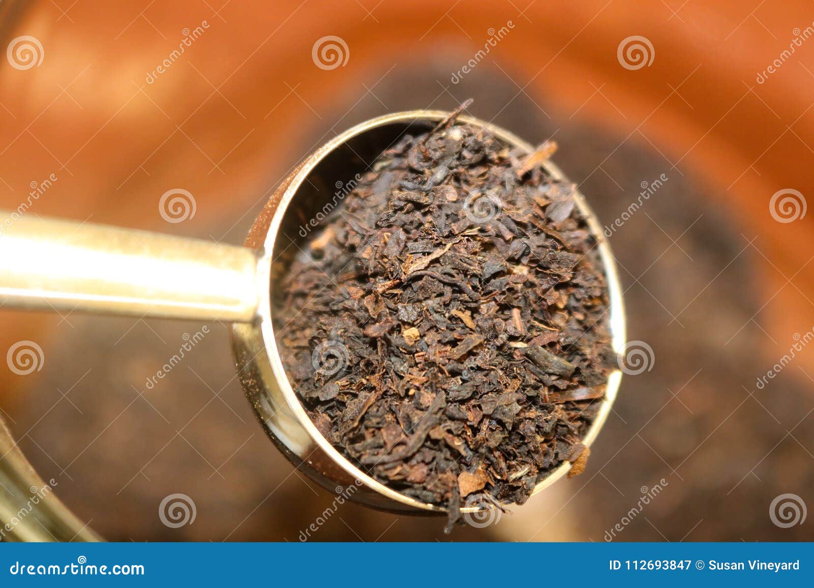 Spooning Loose Tea Leafs Out of a Container - Selective Focus Stock ...