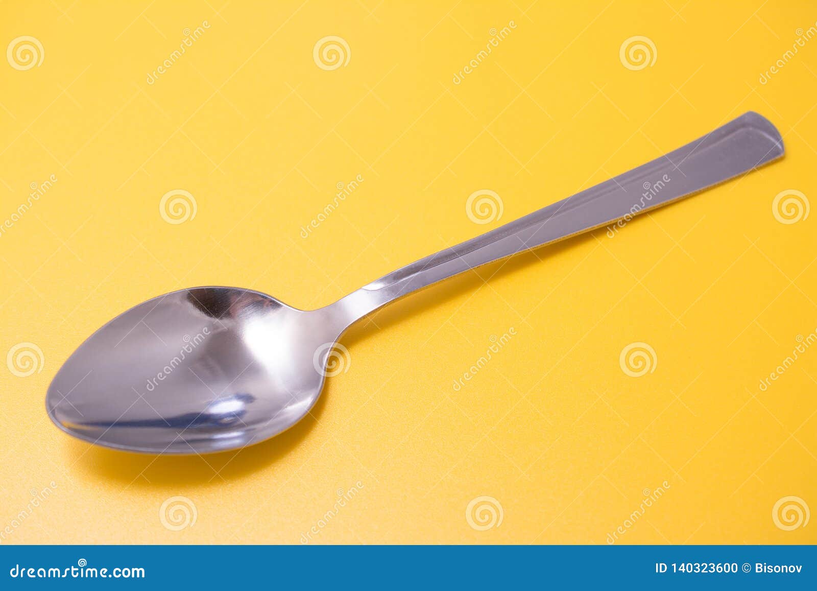 Spoon on a Yellow Background Stock Photo - Image of isolated, pattern ...