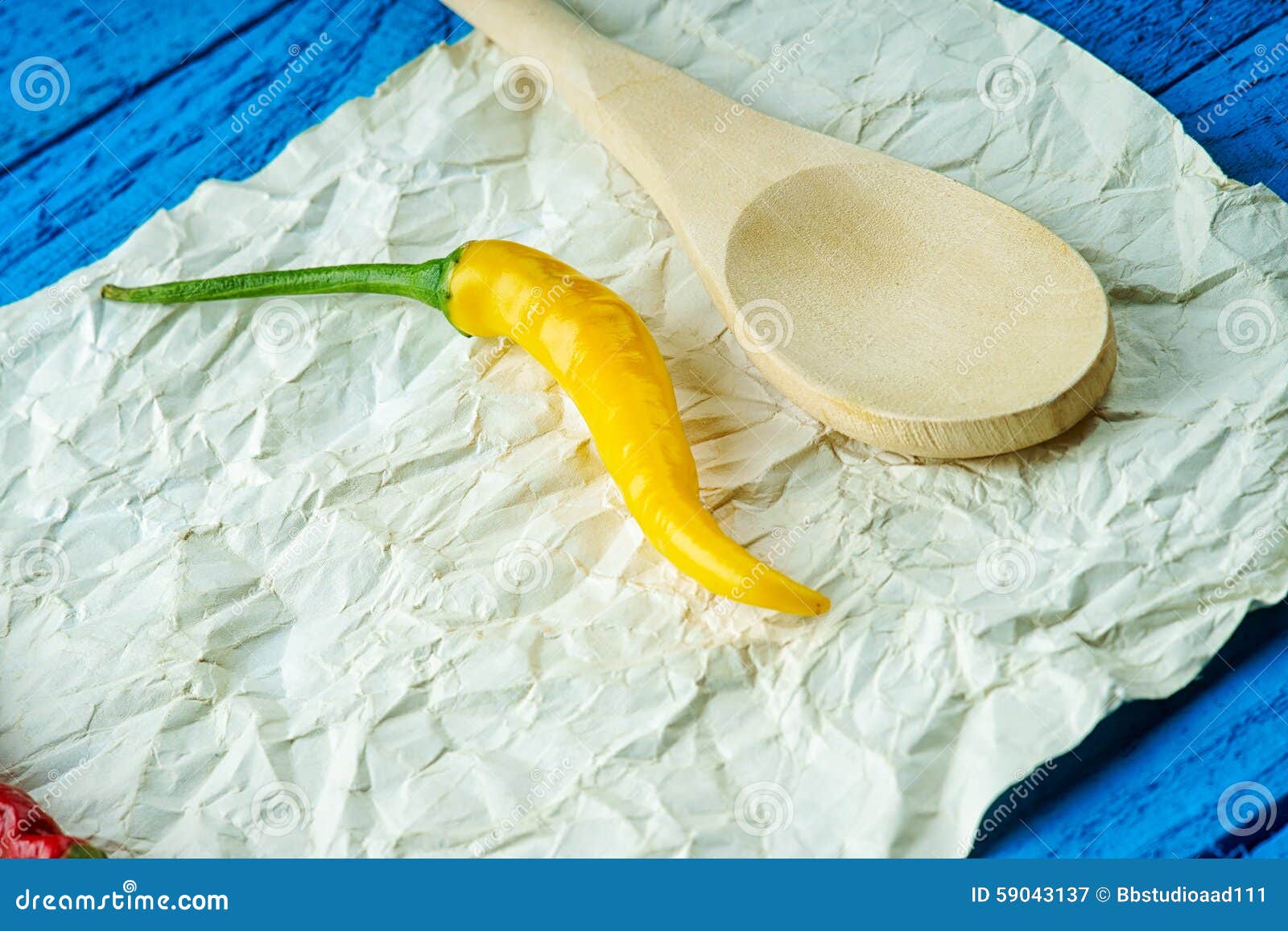Spoon and Yellow Chili Pepper on a Sheet of Paper Stock Image - Image ...