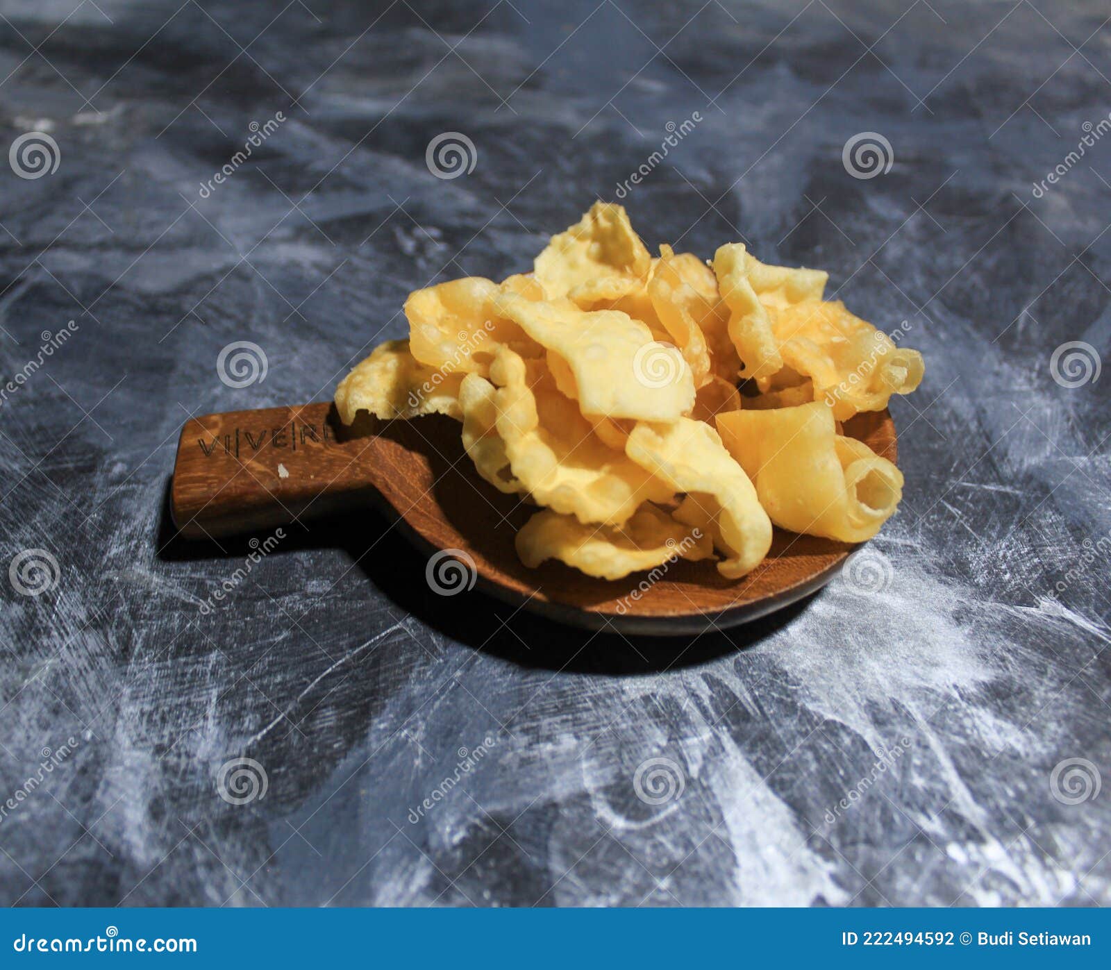 Spooned Golden Dumpling Chips Made from Coconut Shell Stock Photo ...