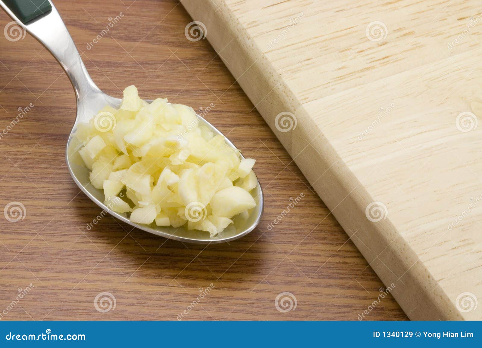 Spoonful of chopped garlic stock image. Image of organic - 1340129
