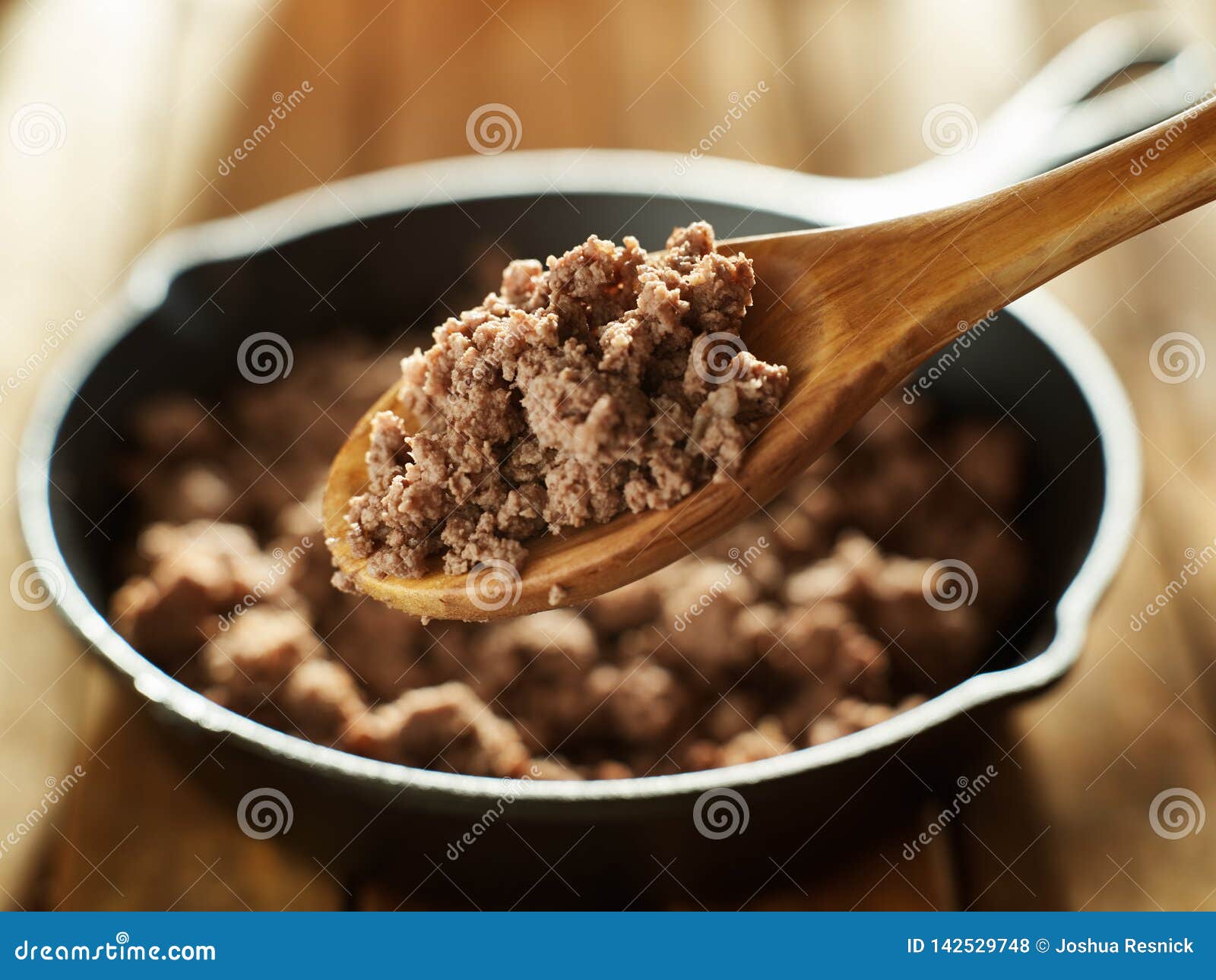 Spoonful of Freshly Cooked Ground Beef from Iron Skillet Stock Photo ...