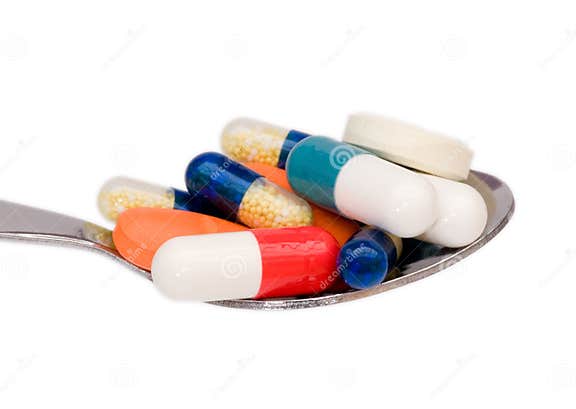 Spoonful of pills stock photo. Image of capsules, drugs - 6762920