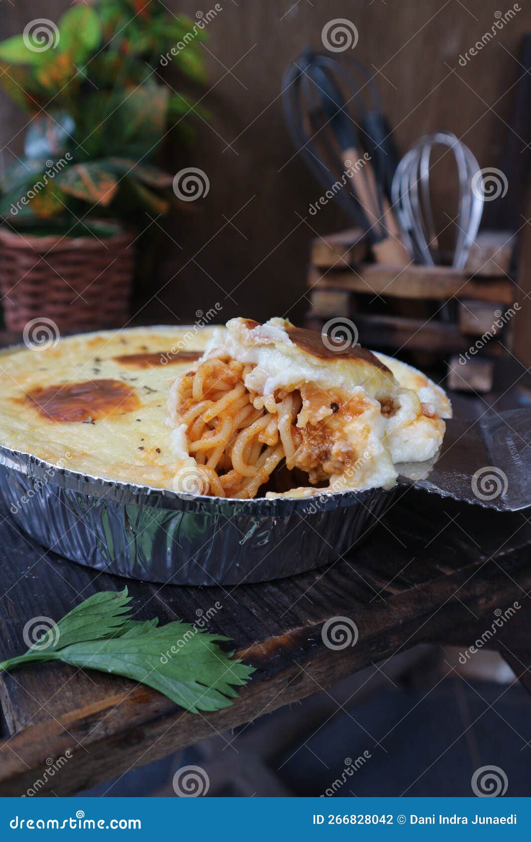 Spooning Spaghetti Brulee while Hot Stock Photo - Image of baking ...