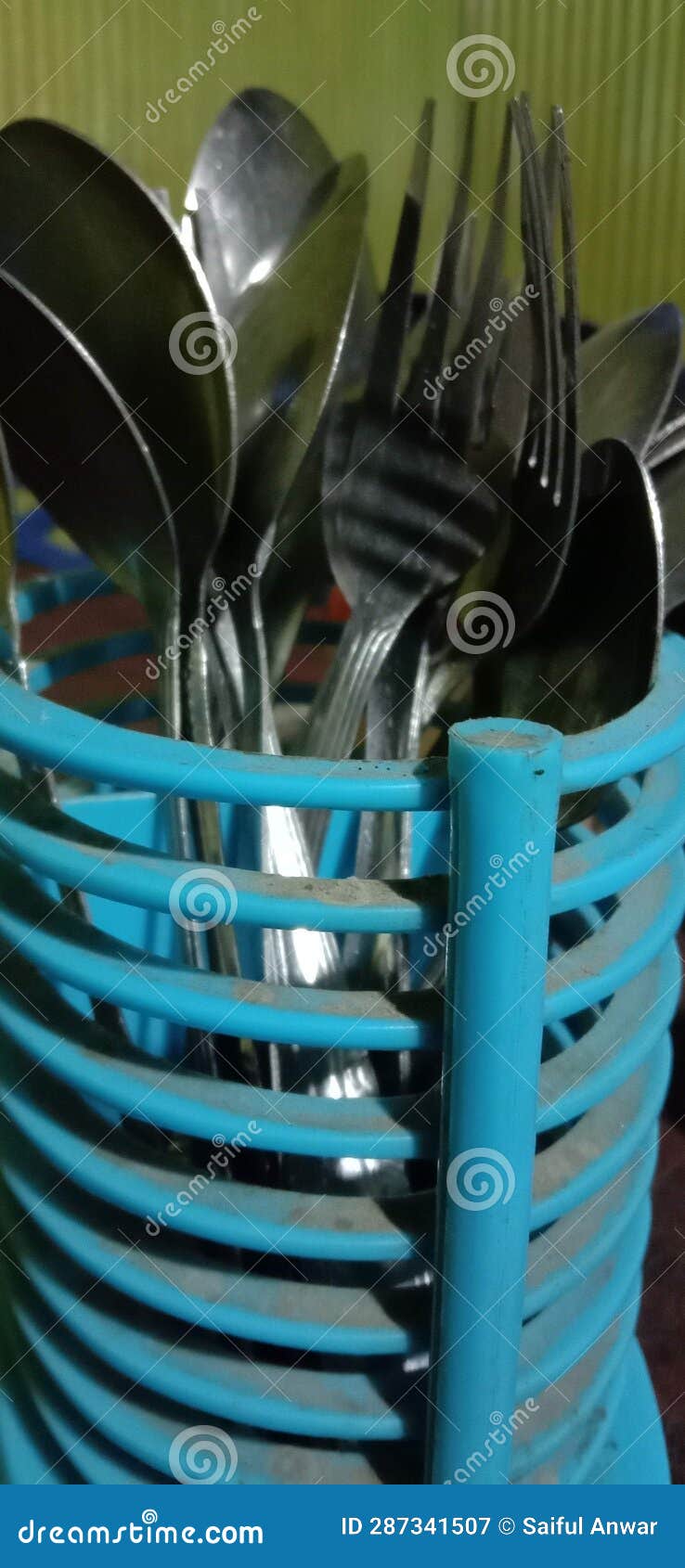 Spoons and Forks Placed in Blue Plastic Bins in the Kitchen Stock Image ...