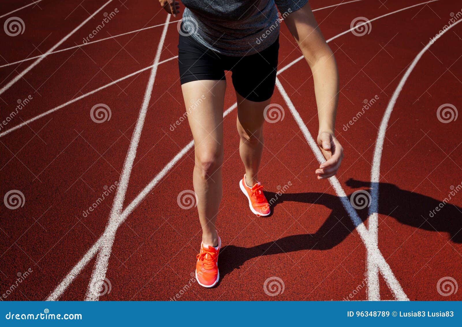 Sport Backgrounds. Sprinter Starting on the Running Track. Dramatic ...