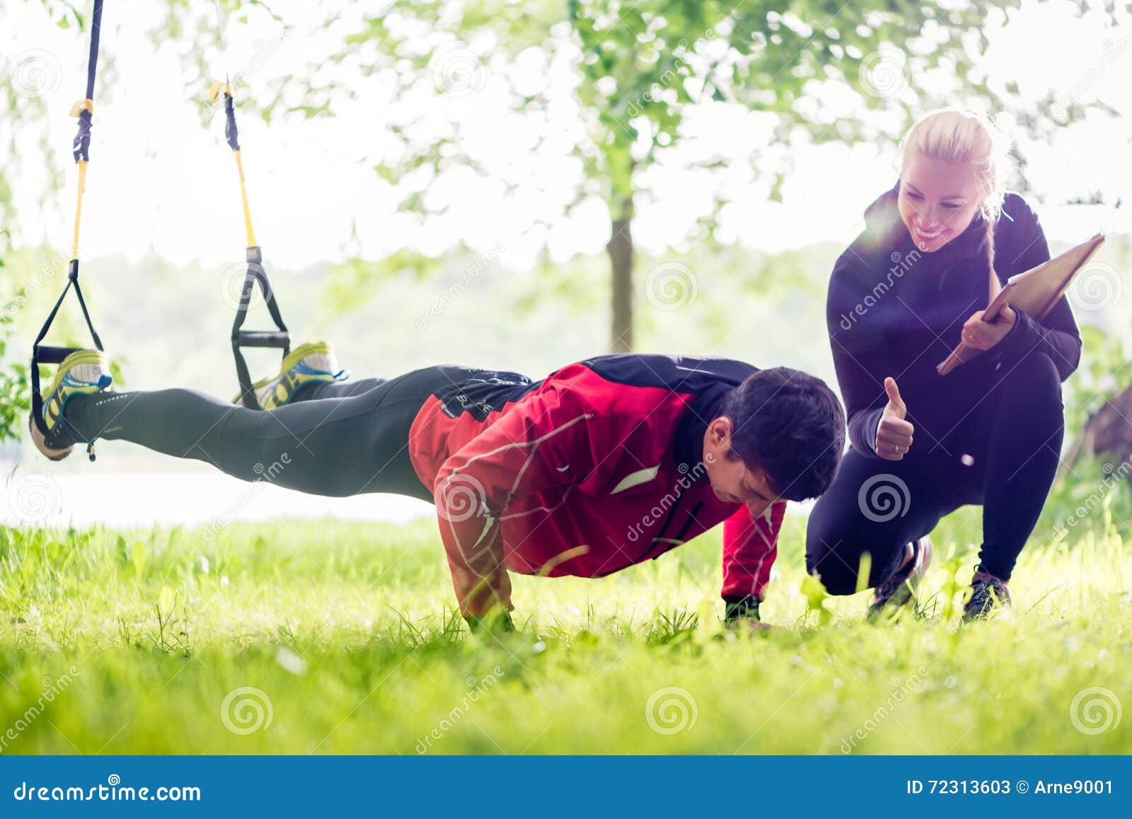 Sport Couple Outdoors with Sling Trainer Stock Image - Image of ...