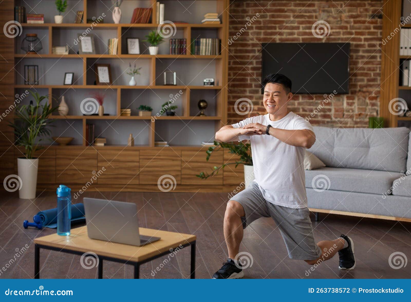 Sport and Healthy Lifestyle Concept. Active Asian Man Watching Training ...