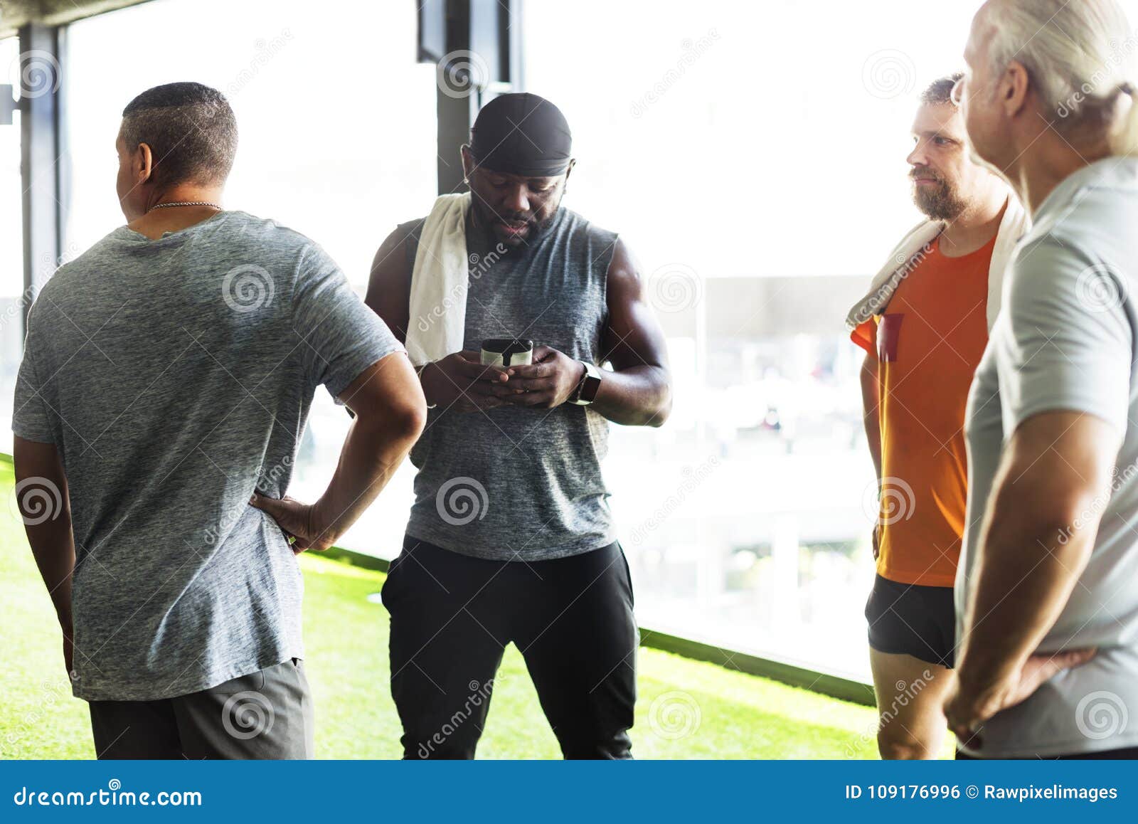Sport Men Using Mobile Phone Stock Photo - Image of devotion, mobile ...