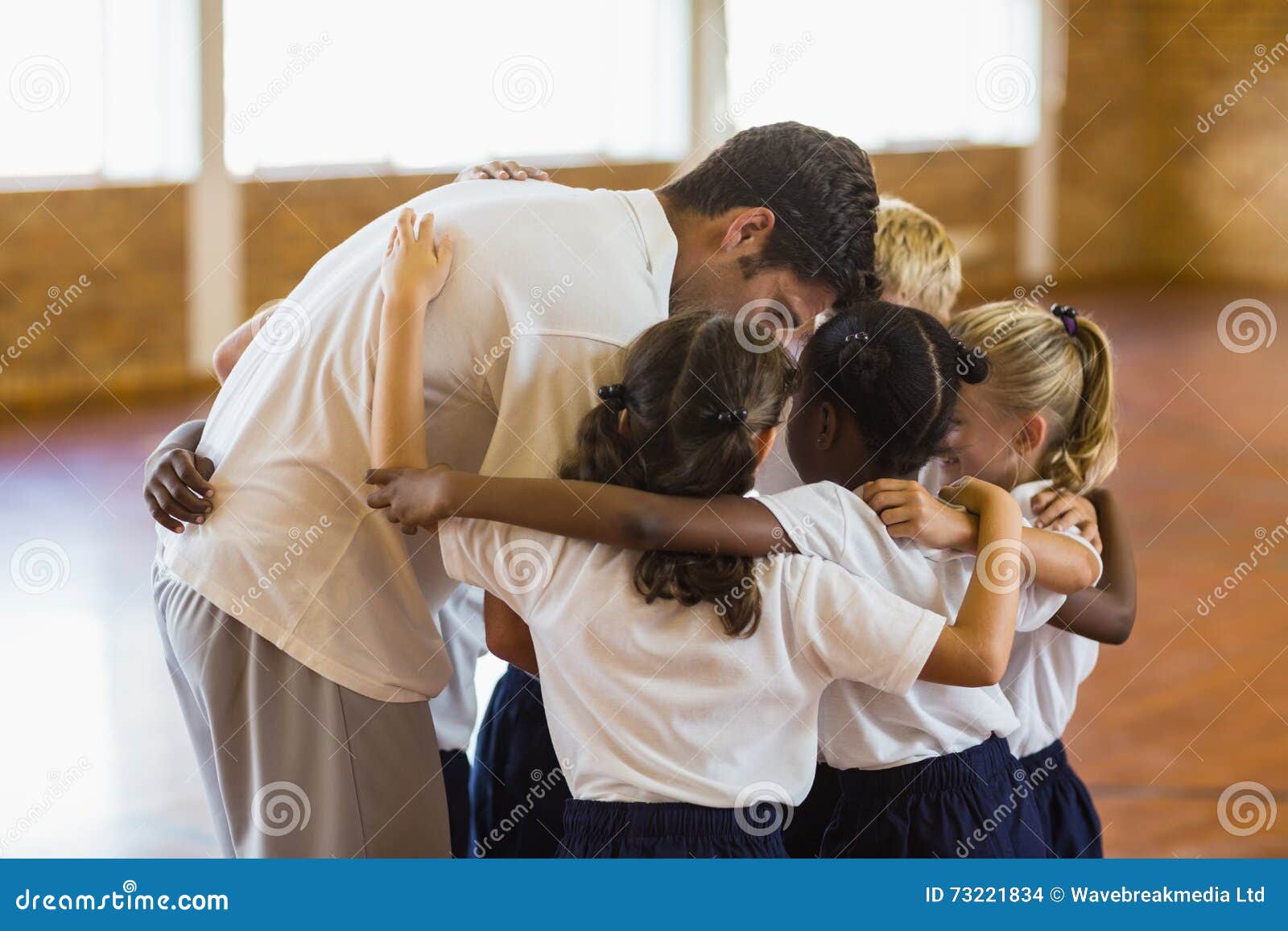 Sport Teacher and Students Forming a Huddle Stock Photo - Image of girl ...