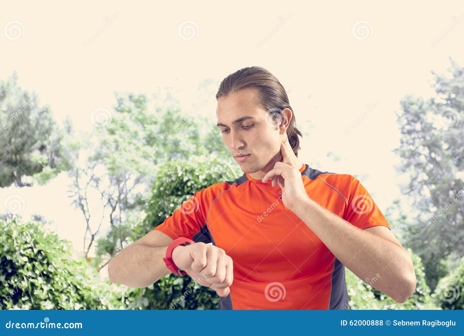Sports man checking pulse stock photo. Image of young - 62000888