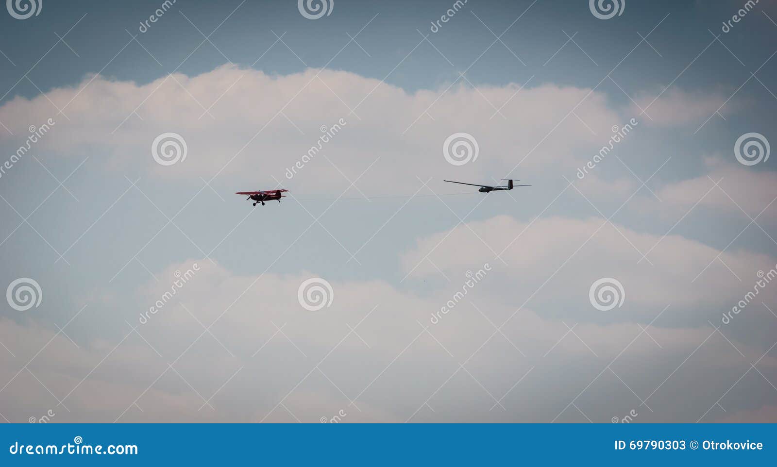 Glider Pulled By Motor Aircraft Stock Photo | CartoonDealer.com #143493348