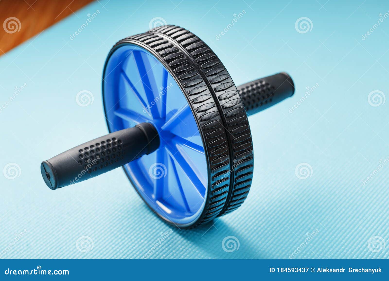 Sports Roll for Training Muscles and Abs on the Blue Mat Stock Image ...