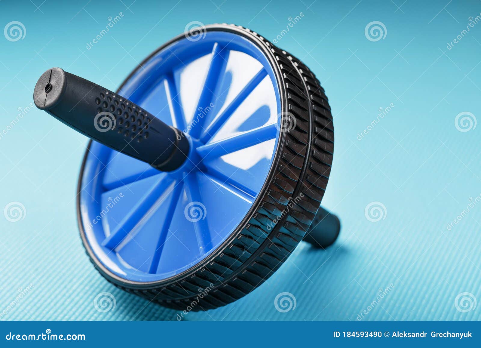 Sports Roll for Training Muscles and Abs on the Blue Mat Stock Photo ...