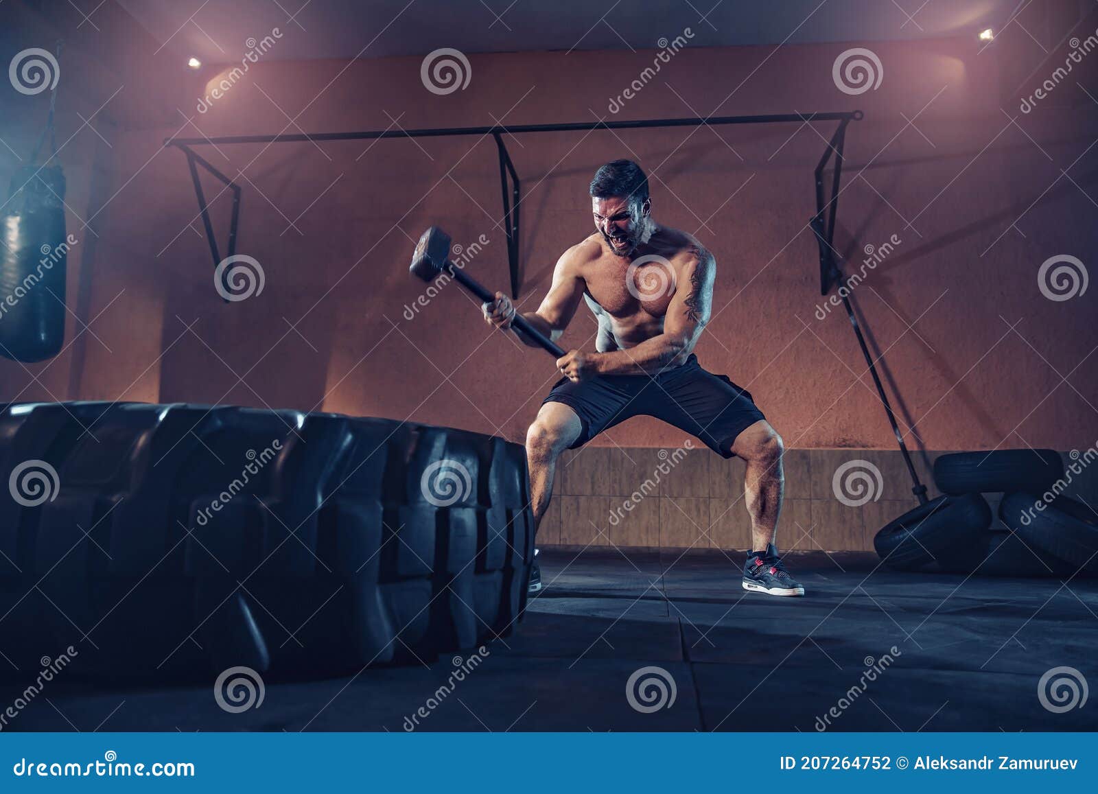 Sports Training for Endurance, Man Hits Hammer. Concept Workout Stock ...
