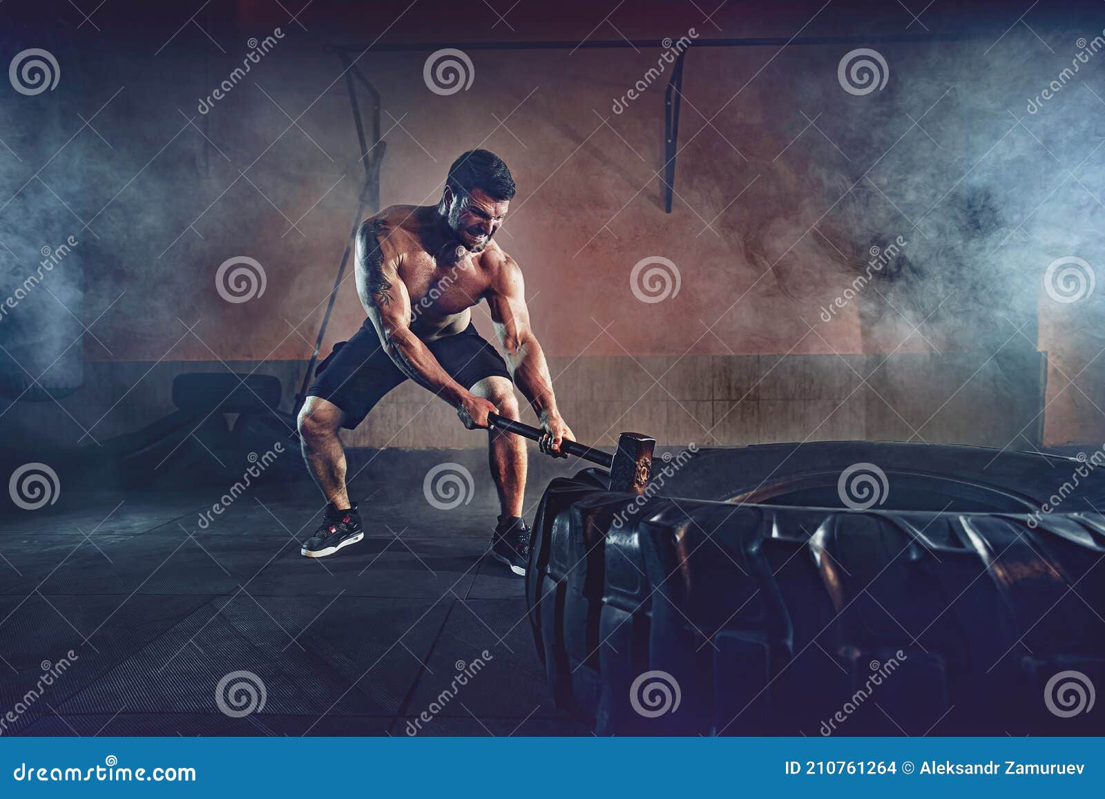 Sports Training for Endurance, Man Hits Hammer. Concept Workout Stock ...