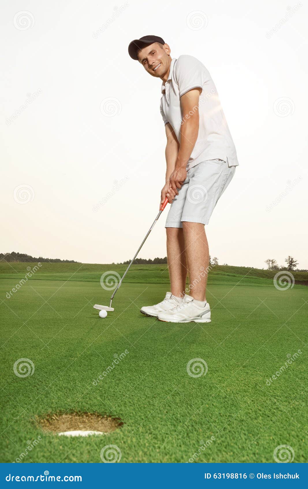 Sportsman Putting Golf Ball into a Hole Stock Photo - Image of game ...