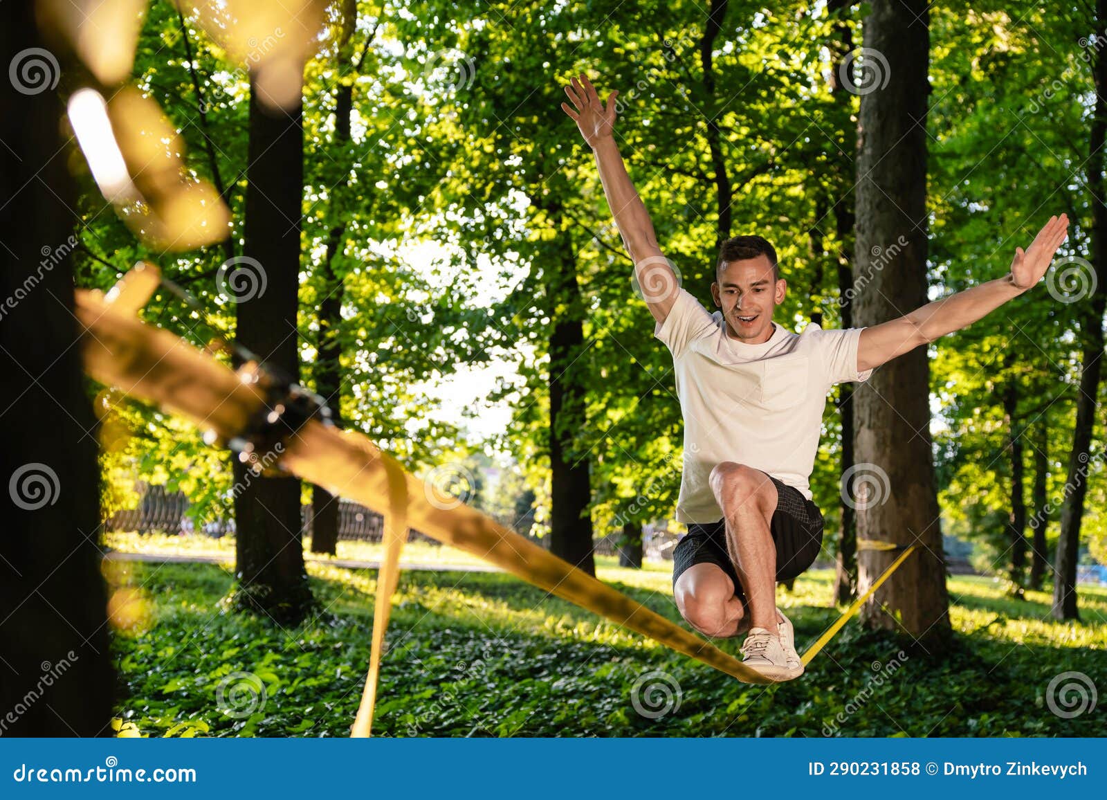Sportsman on the Rope Practising Slacklining and Looking Concentrated ...