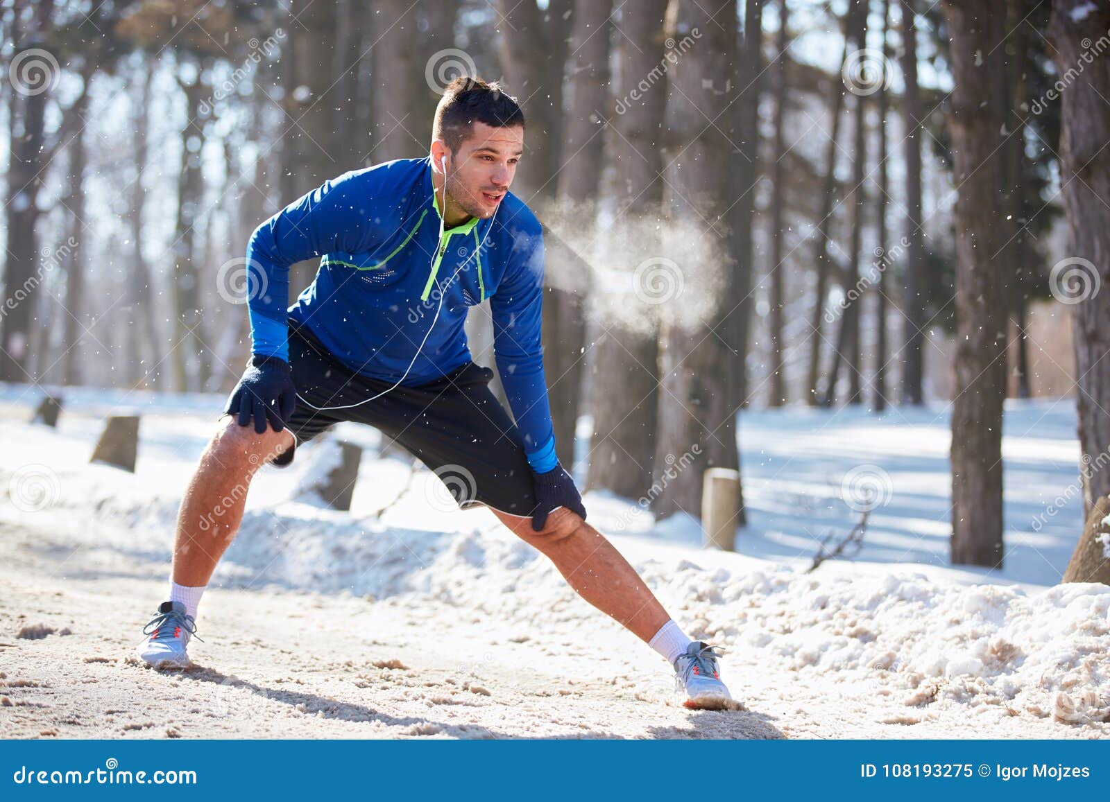 Sportsman Stretching Legs Outdoor Stock Image - Image of person, snow ...