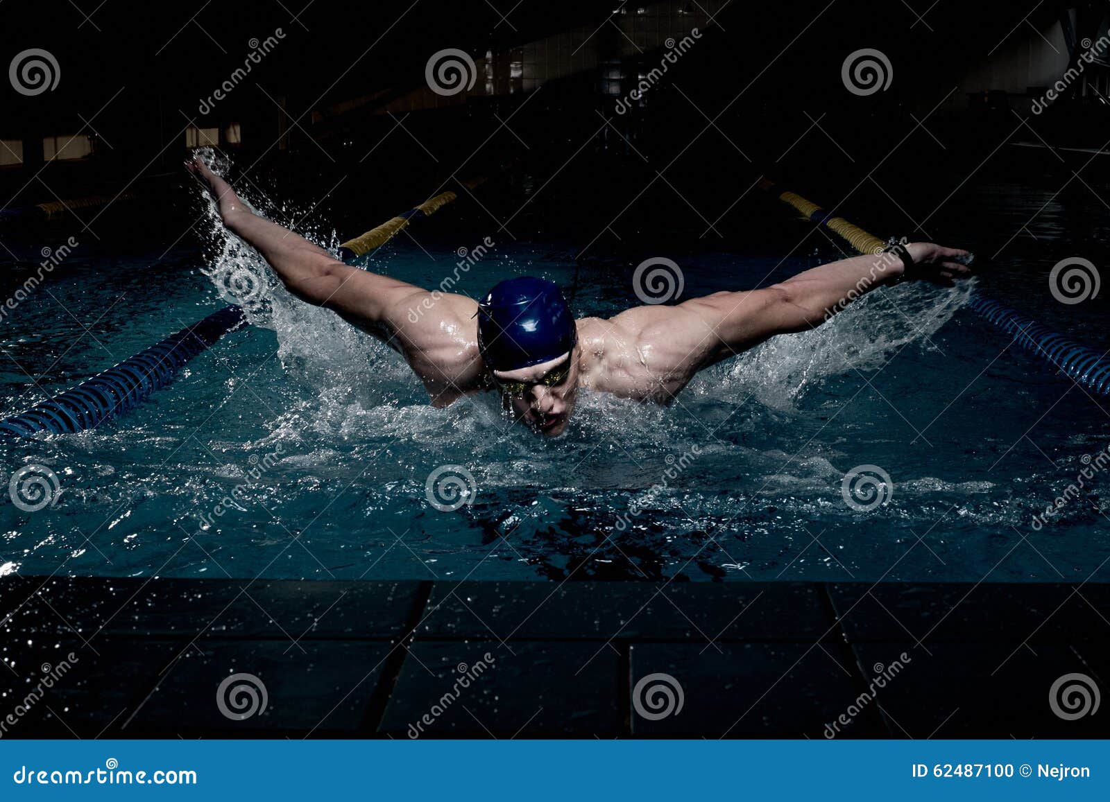 Sportsman in swimming pool stock photo. Image of exercise - 62487100