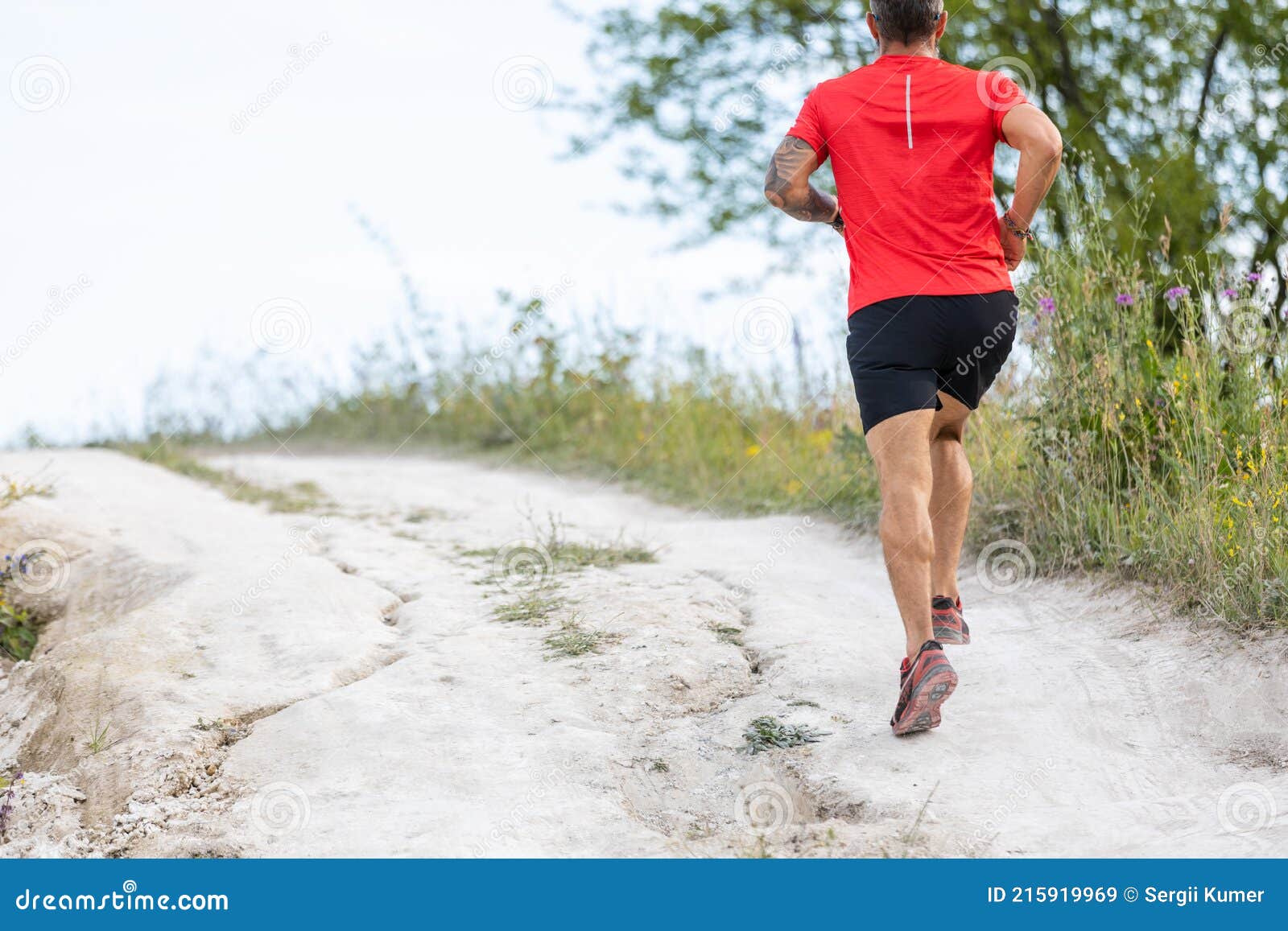 Sporty Bearded Man Running on the Path at Hillside Stock Image - Image ...