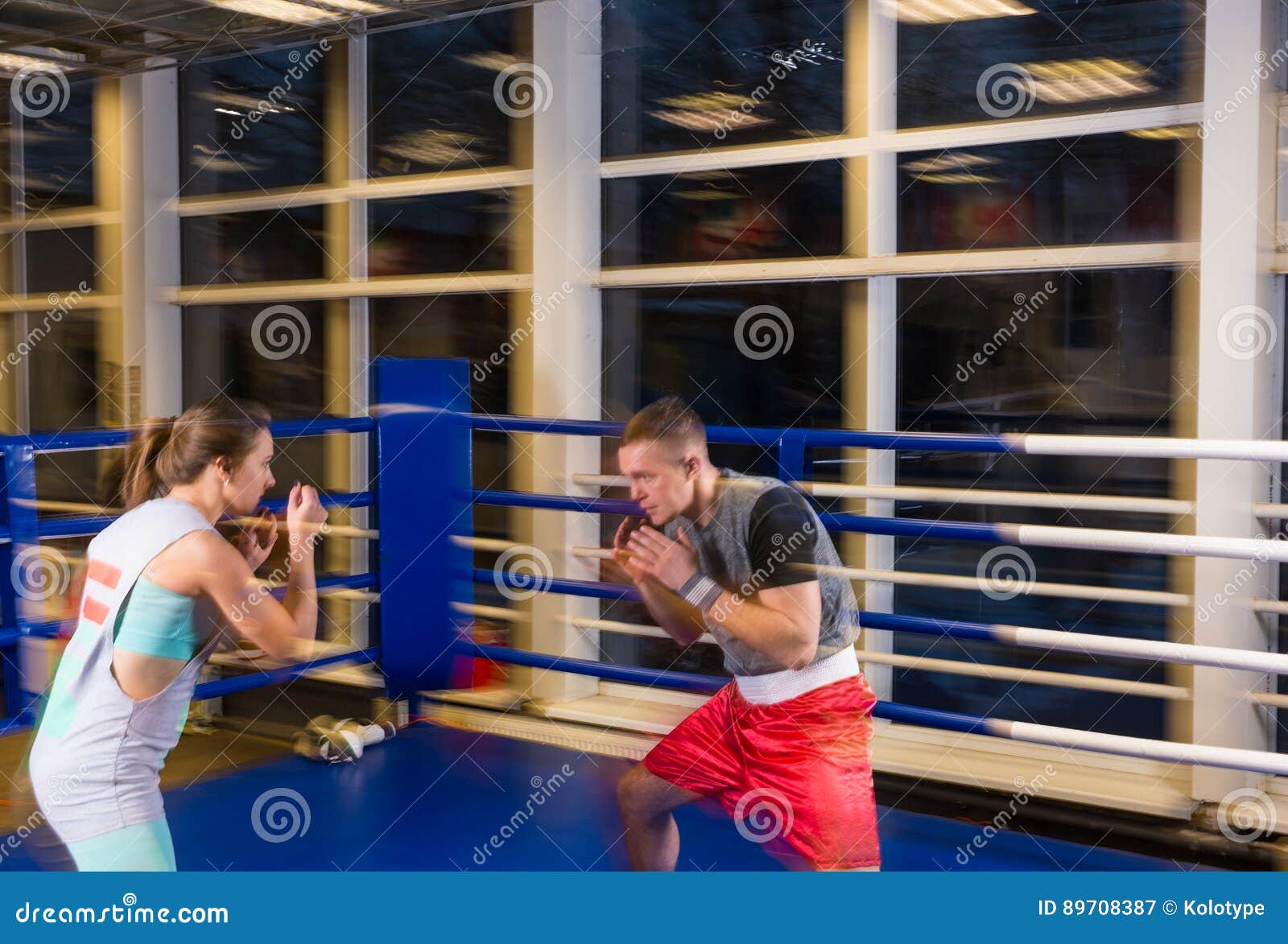 Sporty Couple in Action Practicing Boxing in a Boxing Ring Stock Image ...