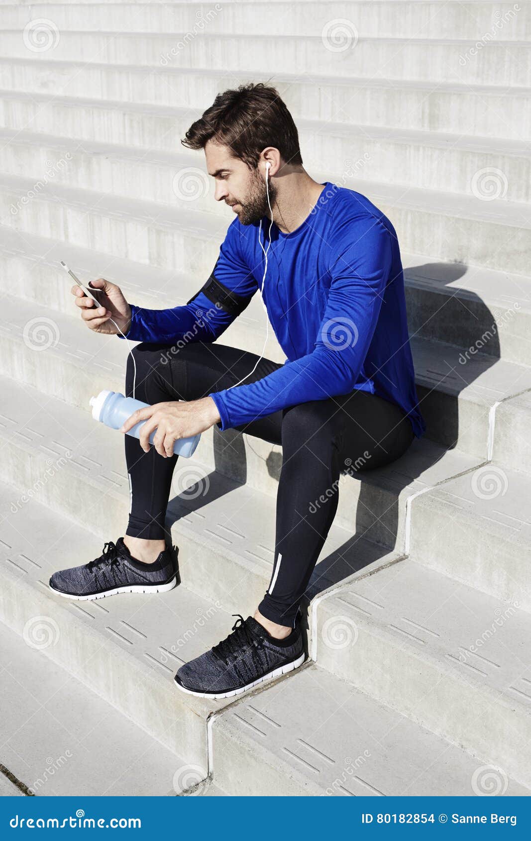 Sporty guy on steps stock photo. Image of holding, full - 80182854