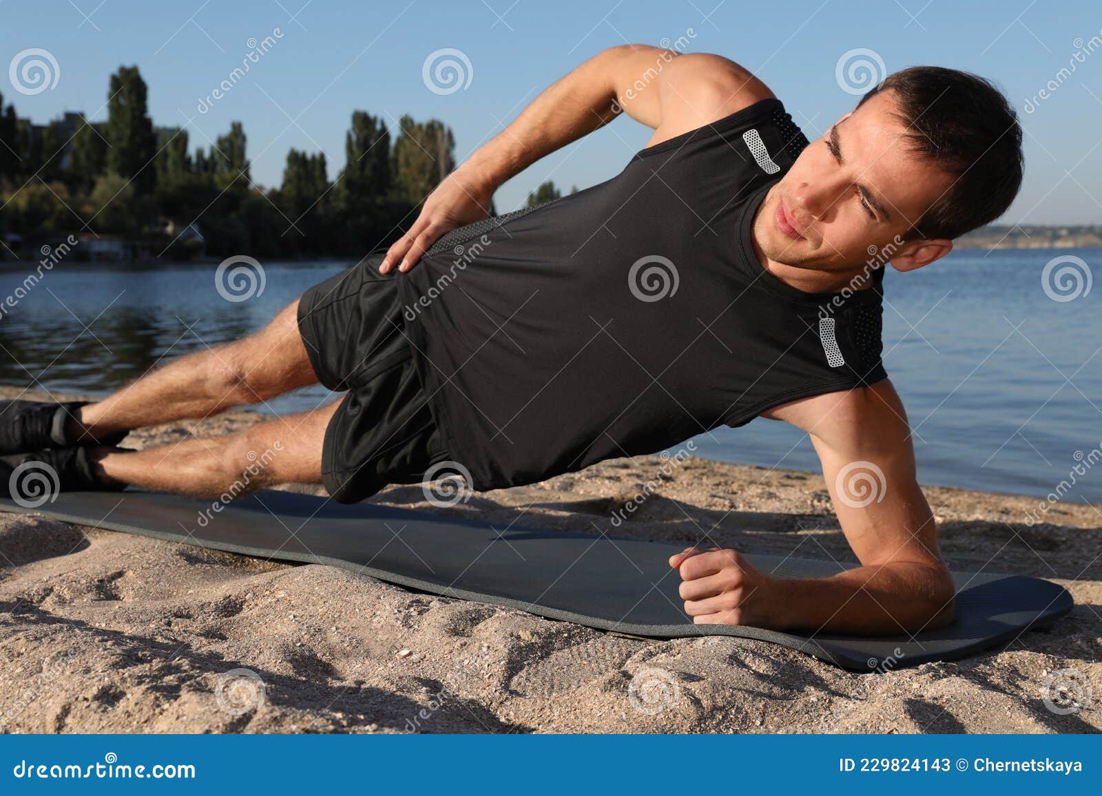 Sporty Man Doing Side Plank Exercise on Beach Stock Image - Image of ...