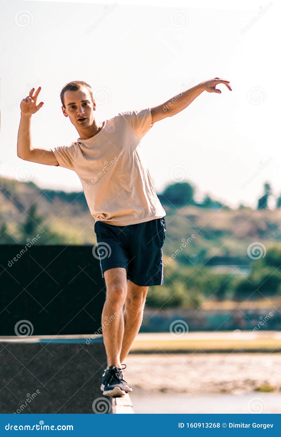 Sporty Man Keep Balancing while Walk on the Edge Stock Photo - Image of ...