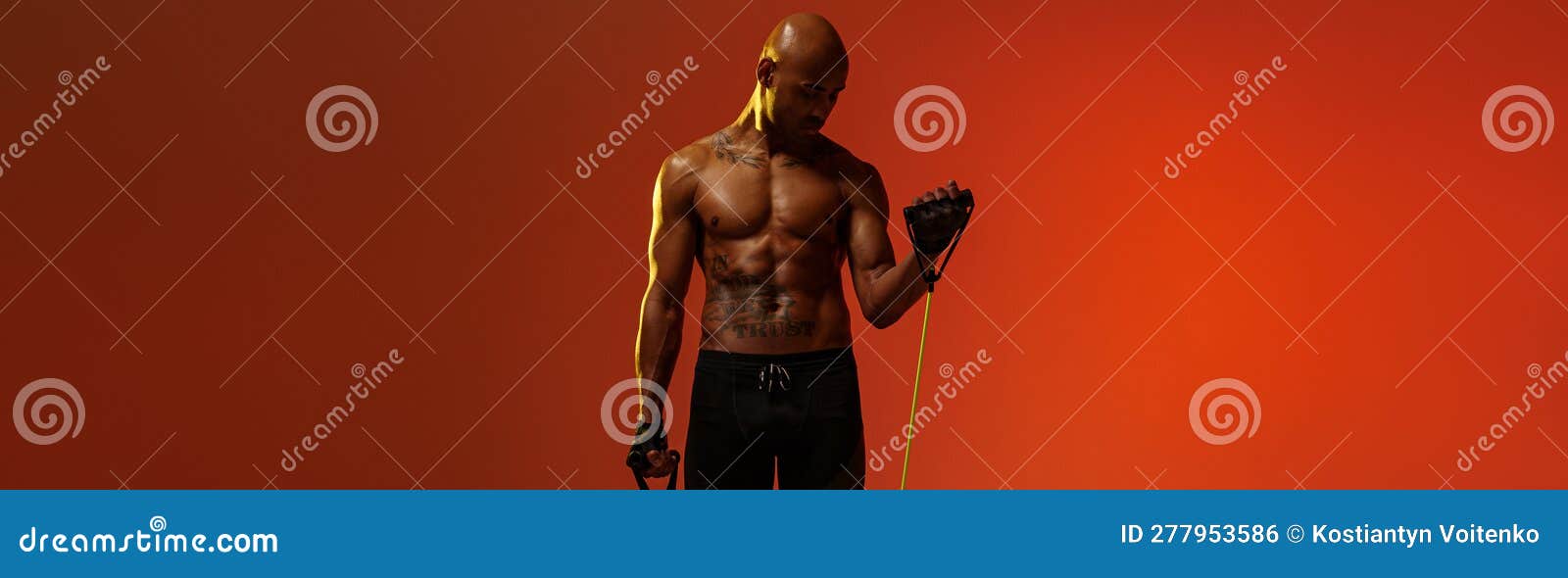 Sporty Man Performs Exercises with Expander on Studio Background ...