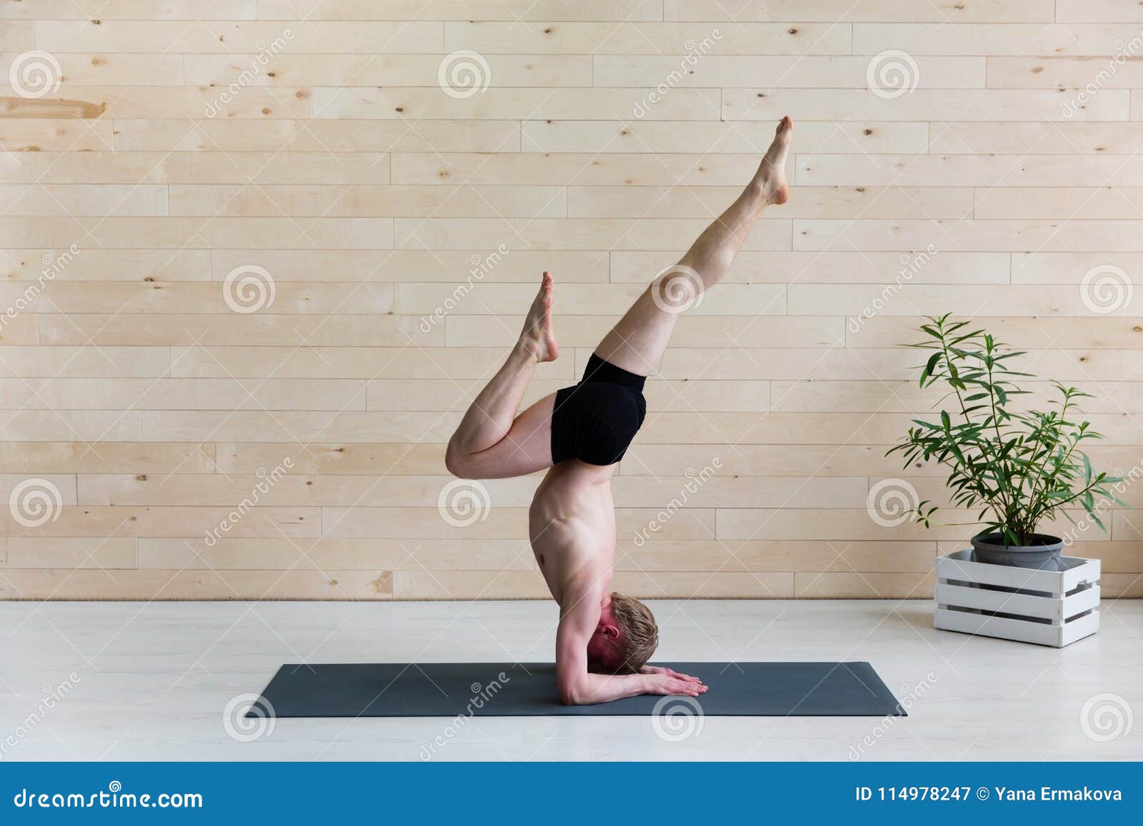Sporty Man Practicing Yoga. Head Stand Stock Image - Image of inversion ...