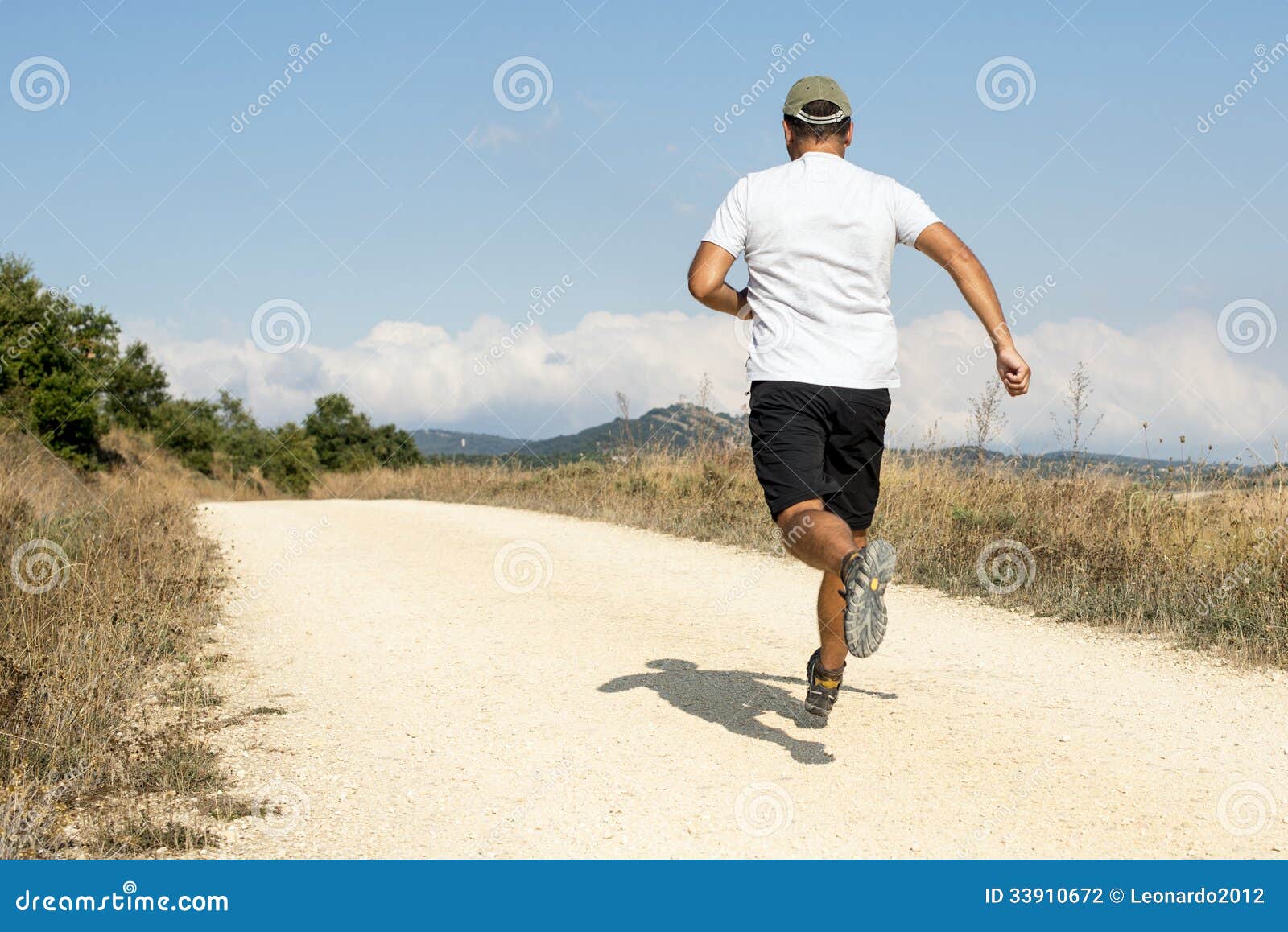 Sporty Man Running Down the Sandy Track. Stock Photo - Image of fitness ...