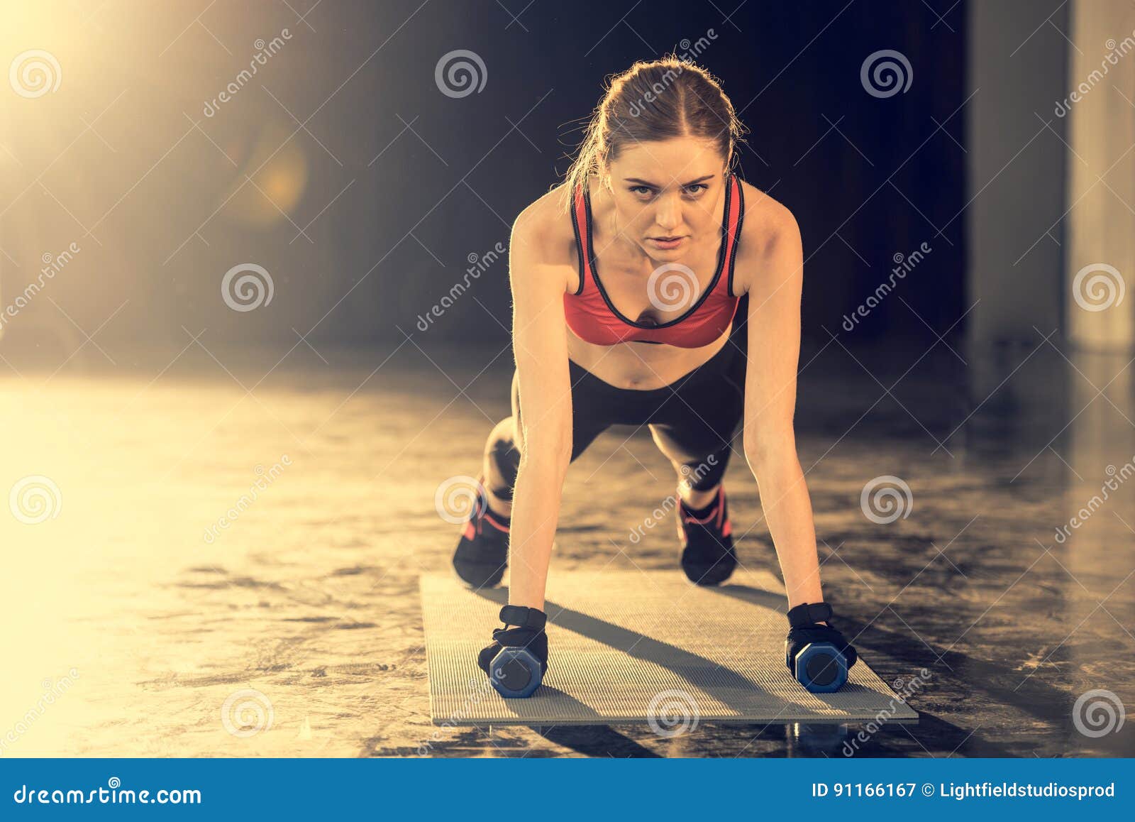 Sporty Woman Doing Plank Exercise with Dumbbells Stock Image - Image of ...