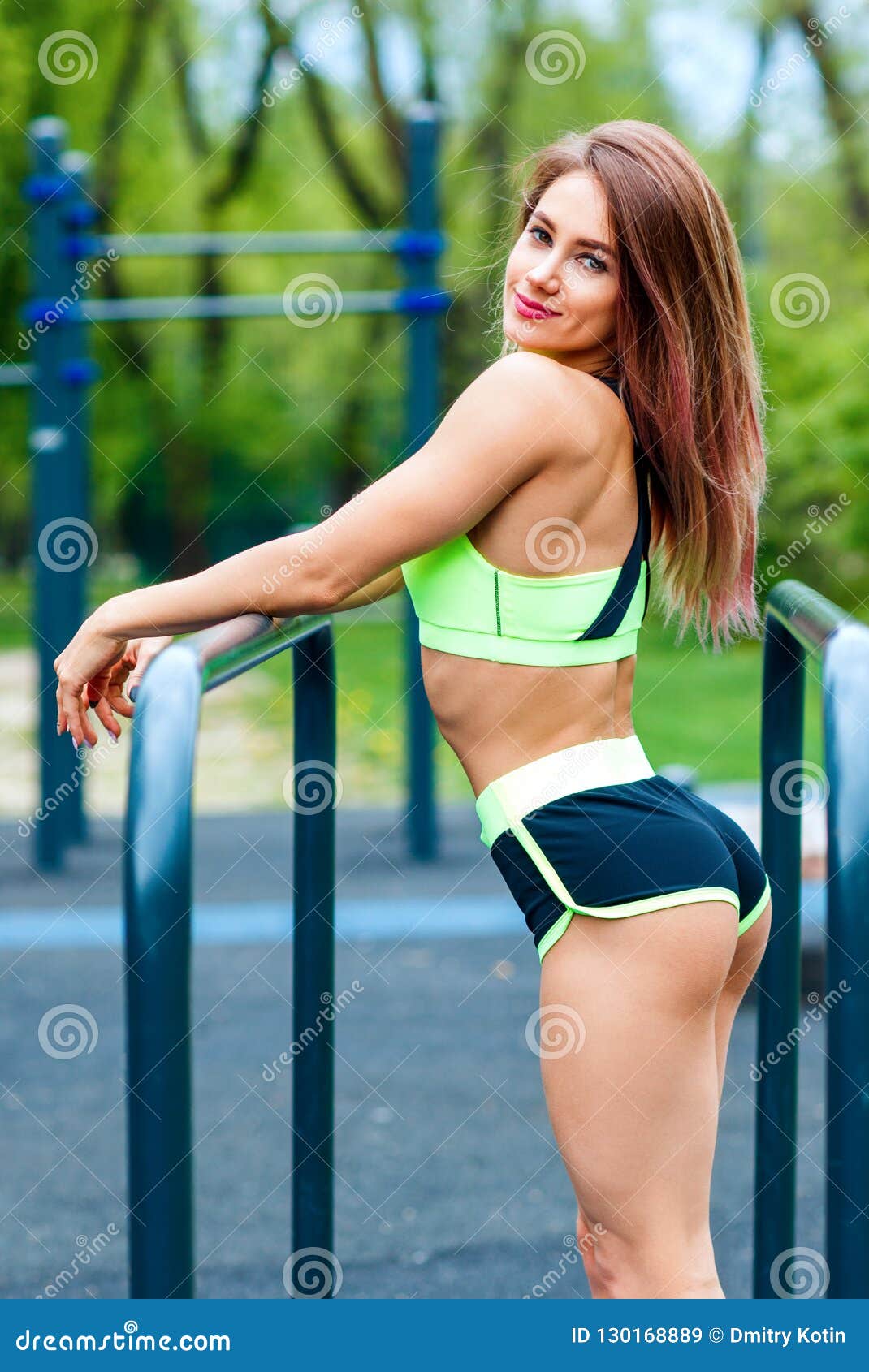 Sporty Woman with Perfect Athletic Body Posing on Sportsground. Stock ... Sporty Woman with Perfect Athletic Body Posing on Sportsground. Stock ...