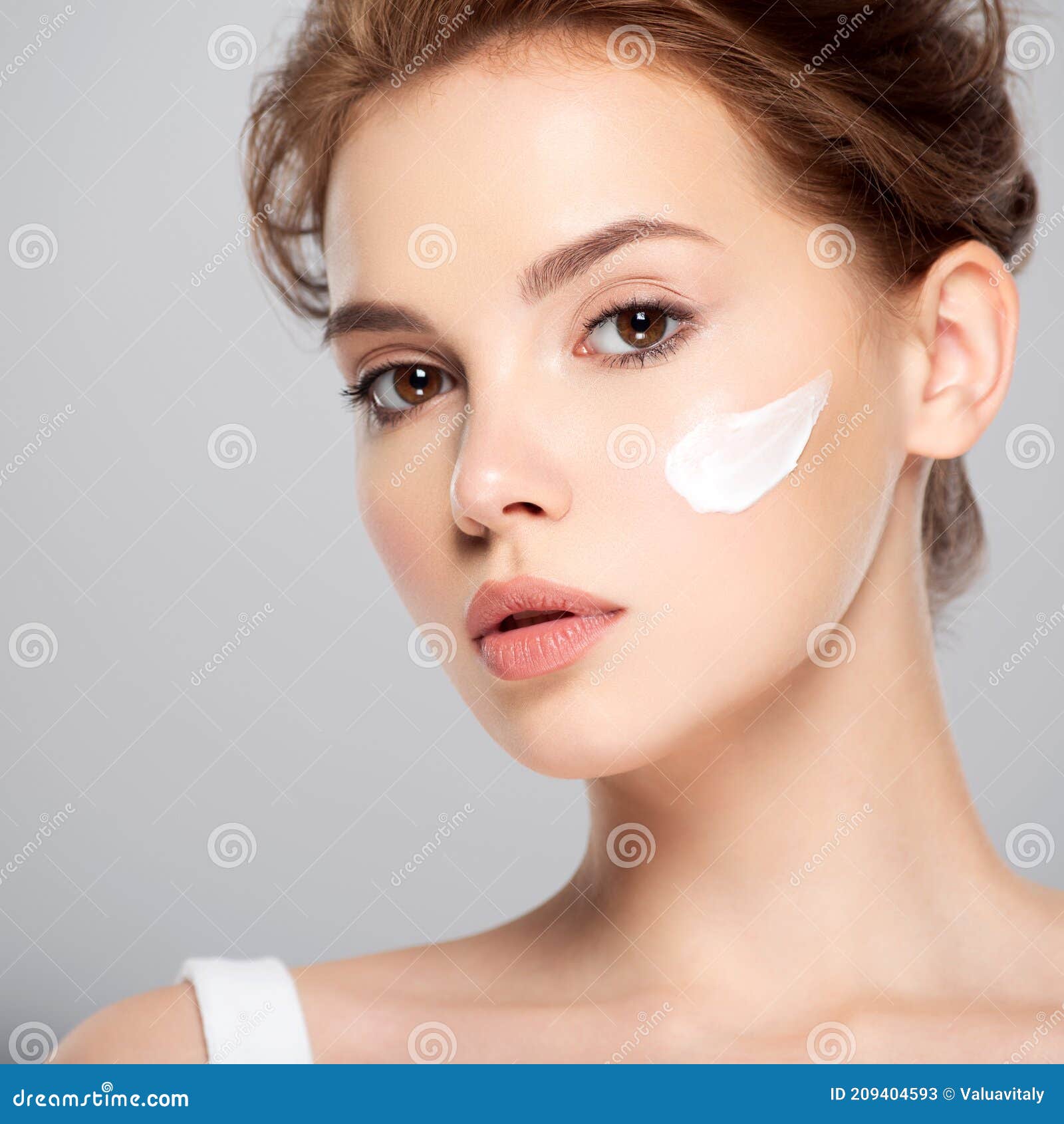 Spot Of Cosmetic Cream On A Woman`s Face Beautiful Face Of Young