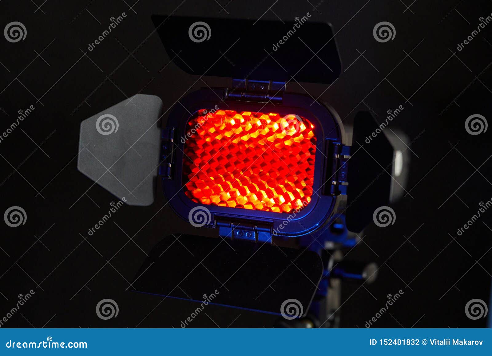 Spotlight with Red Light and Honeycomb. Photo and Video Equipment for ...