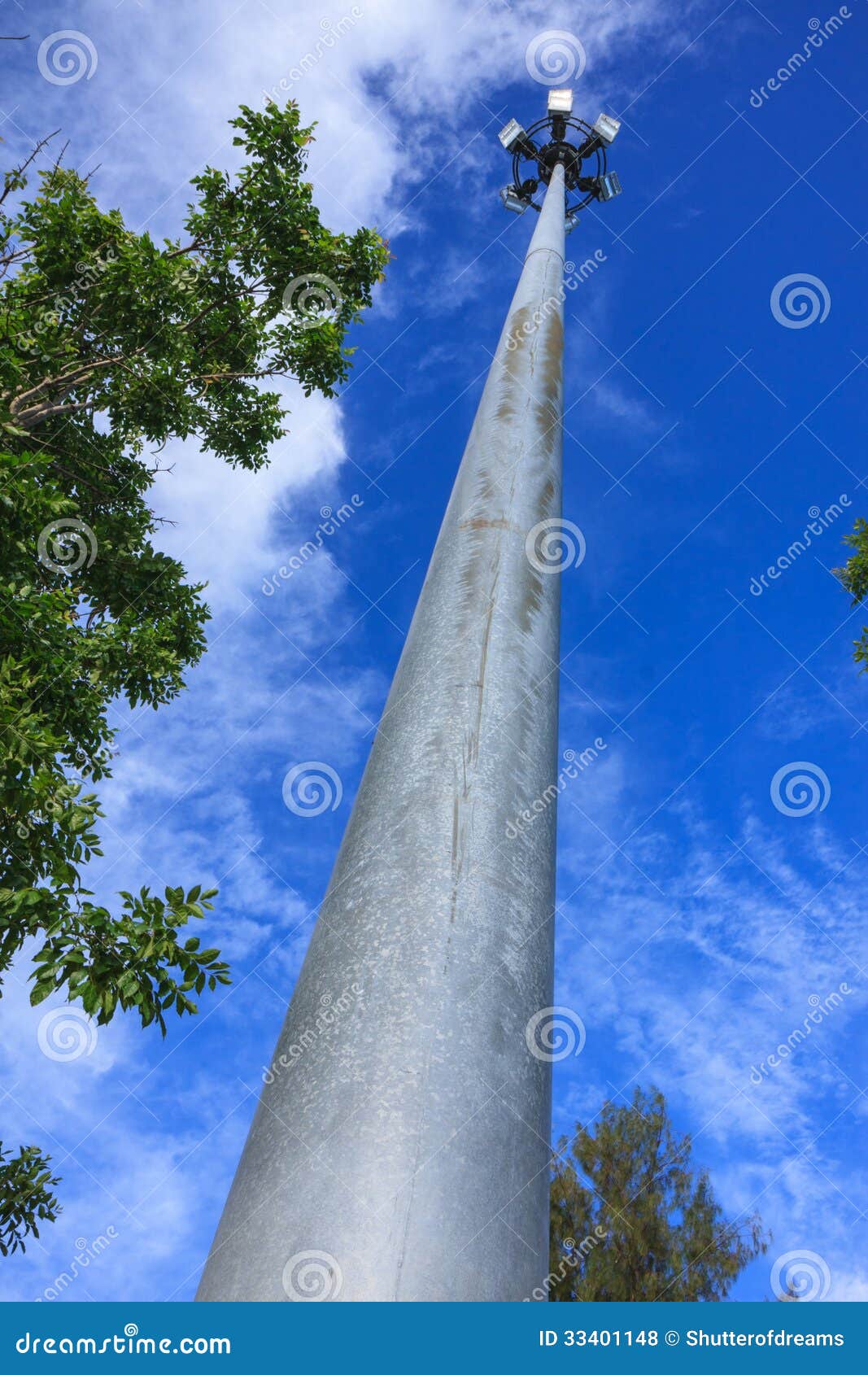 Spotlight Tower with Tall Tree and Blue Sky Stock Photo - Image of ...