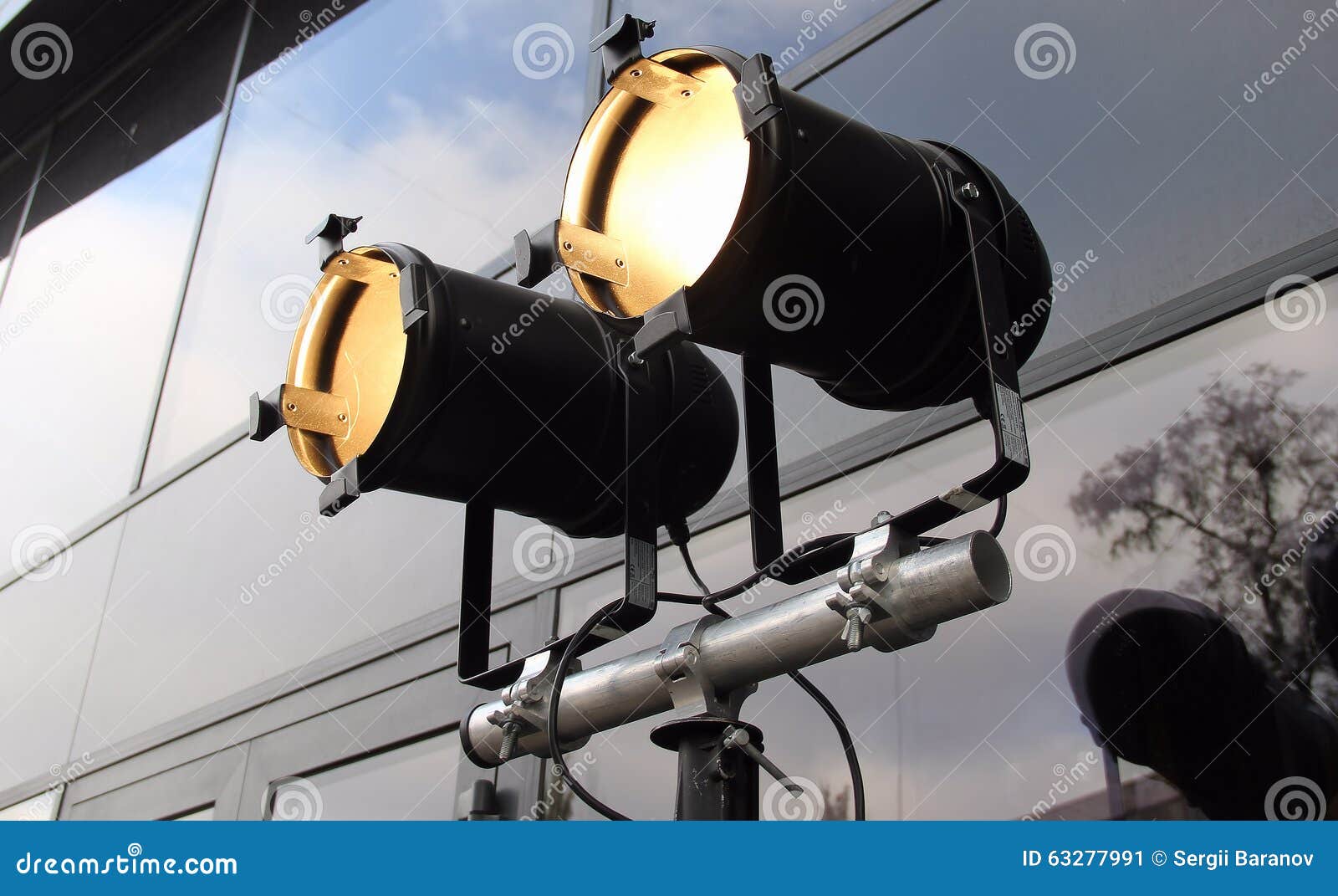 Spotlights on Tripod Over Glass Wall Stock Image - Image of cinema ...