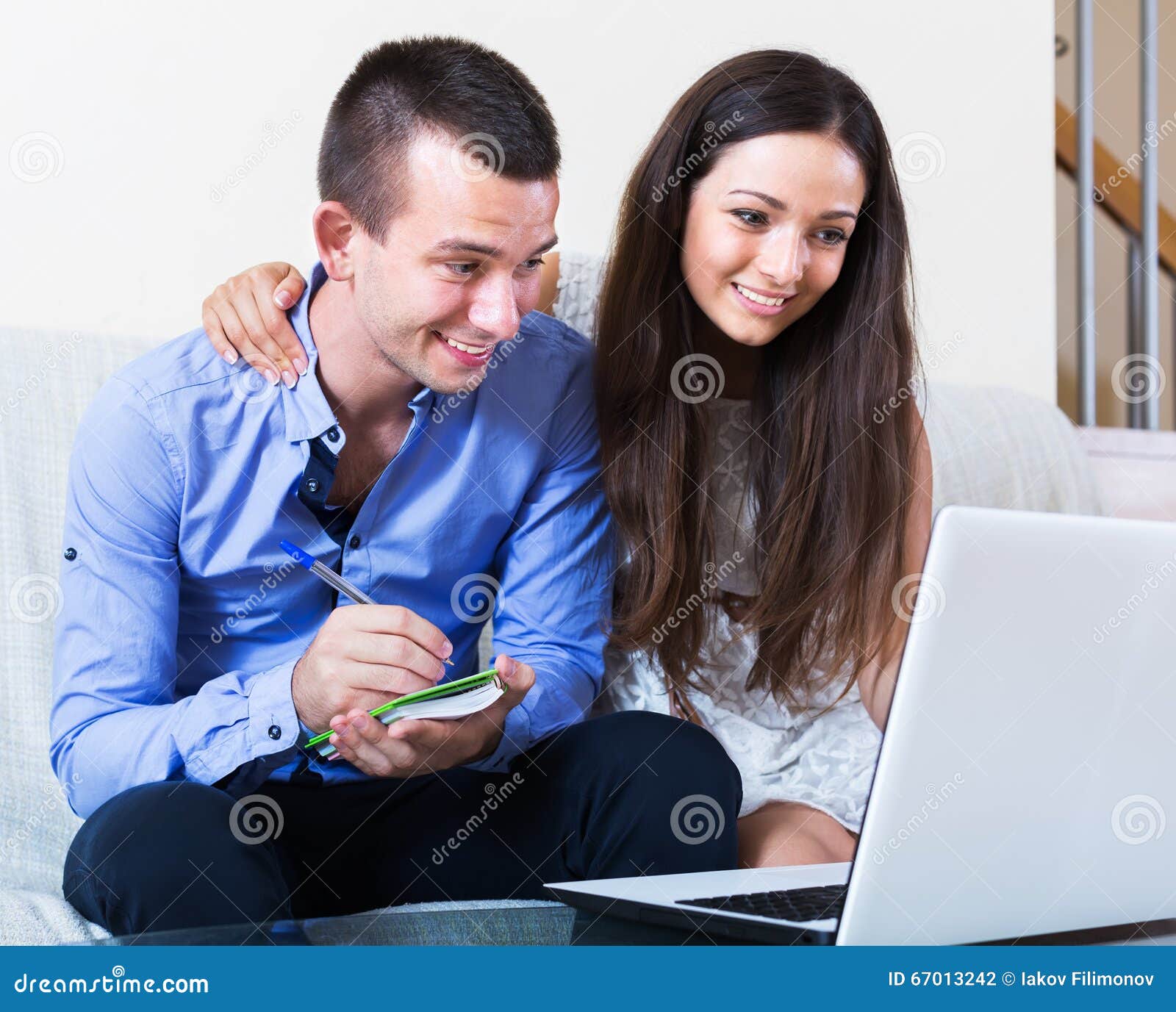 Spouses Making Notes on Laptop Stock Photo - Image of family, male ...
