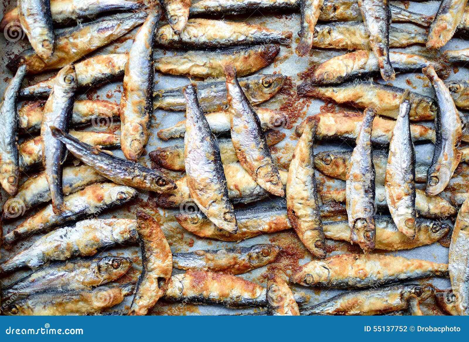 Sprats Fish On Inox Fork Above Metal Jar, Smoked Herring. Close Up ...