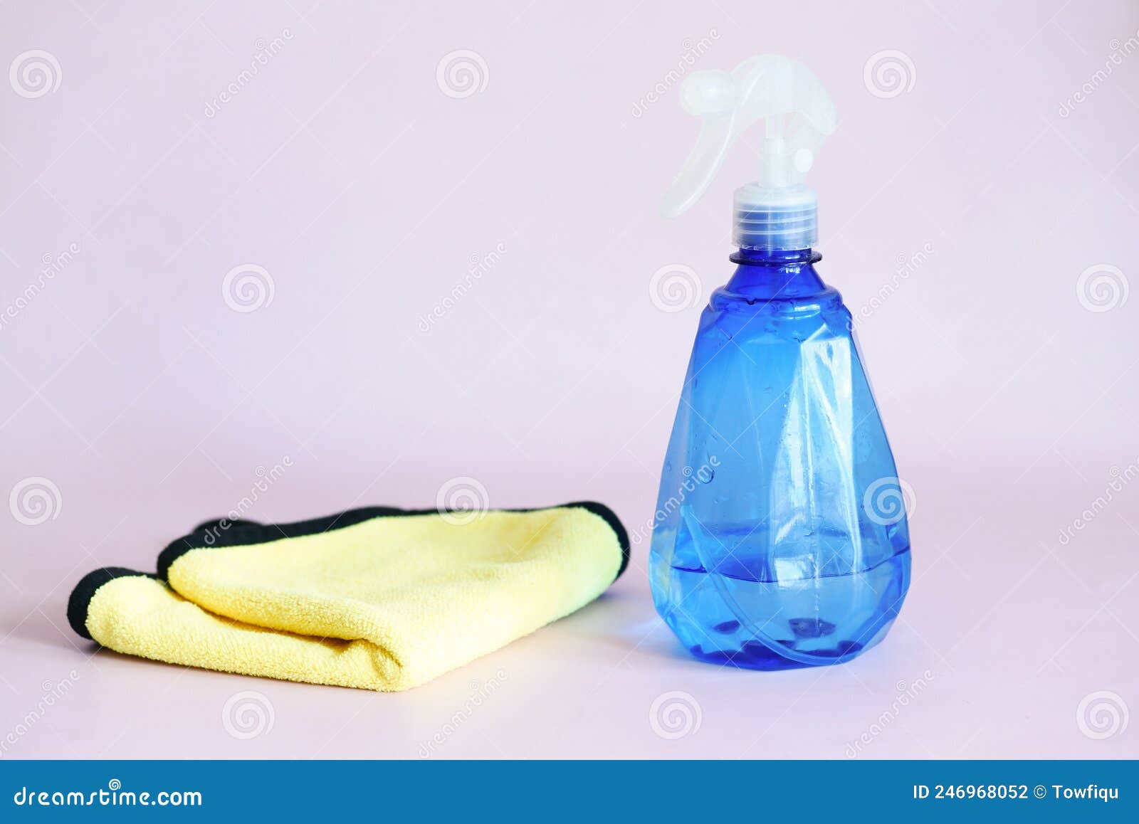 Spray Bottle and a Cleaning Cloth on Table Stock Photo - Image of ...
