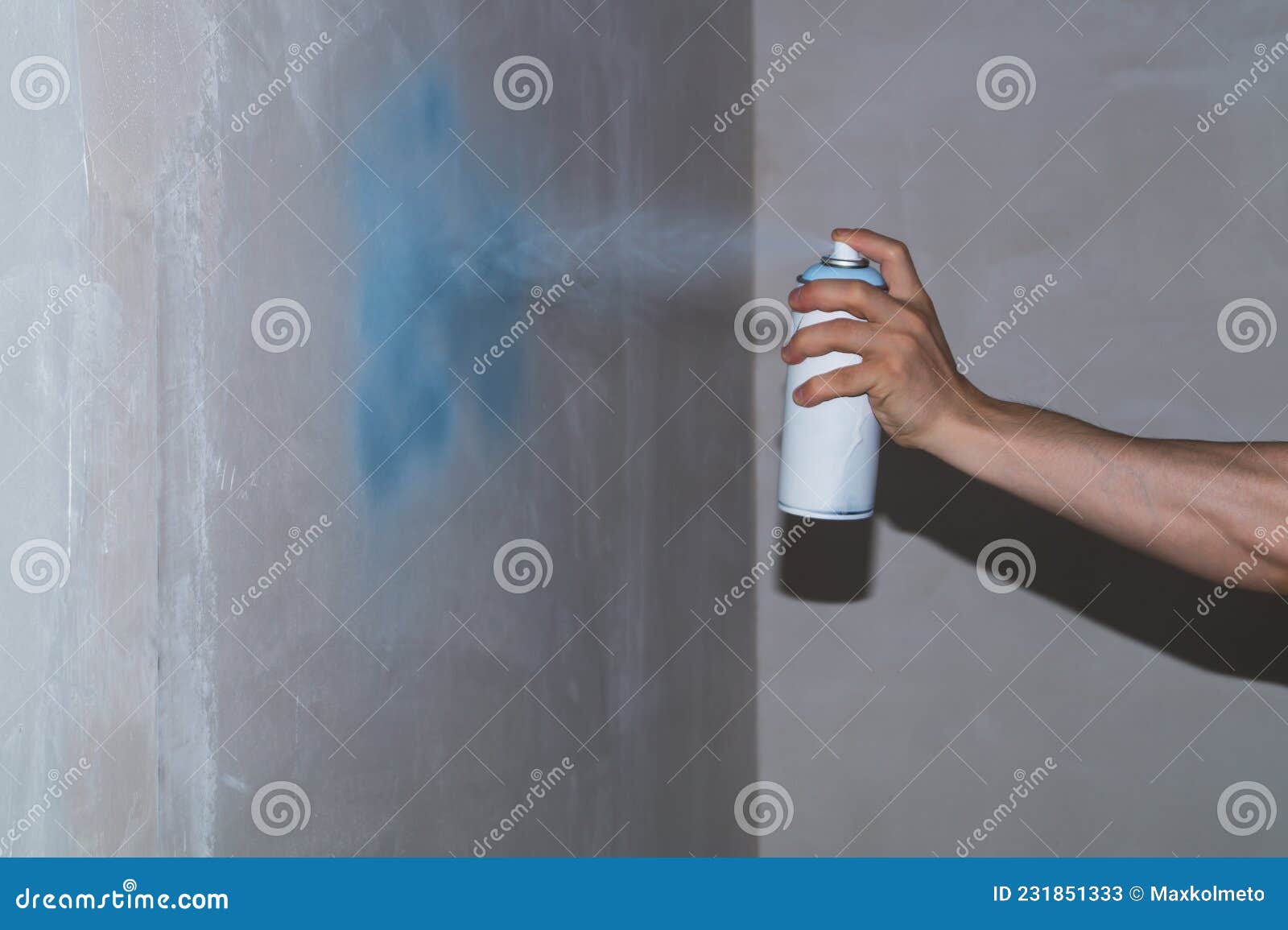 Spray Can in Hand. Spraying Paint on the Wall. Painting Process Stock ...